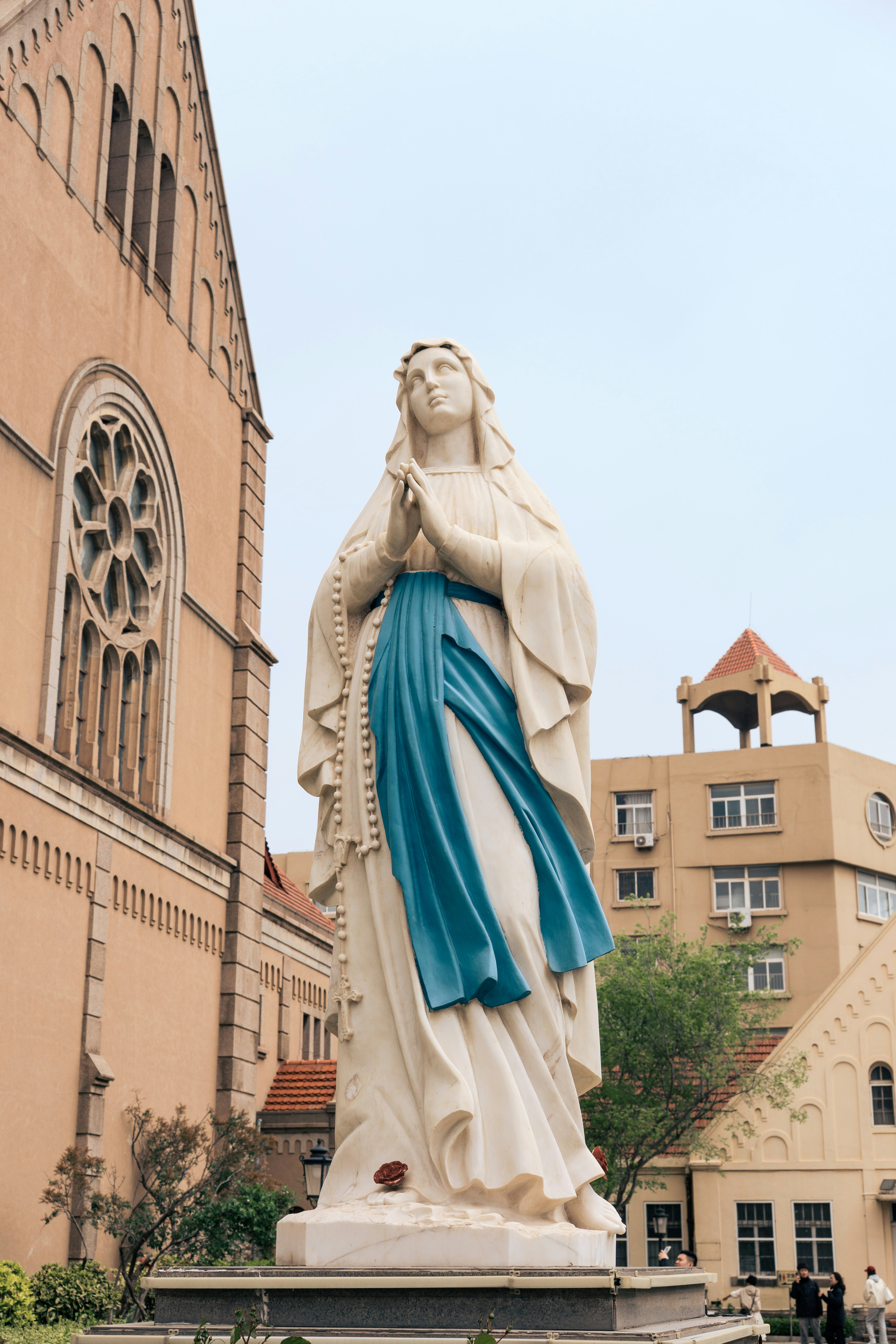 Praying Figure at the Riverside Basilica