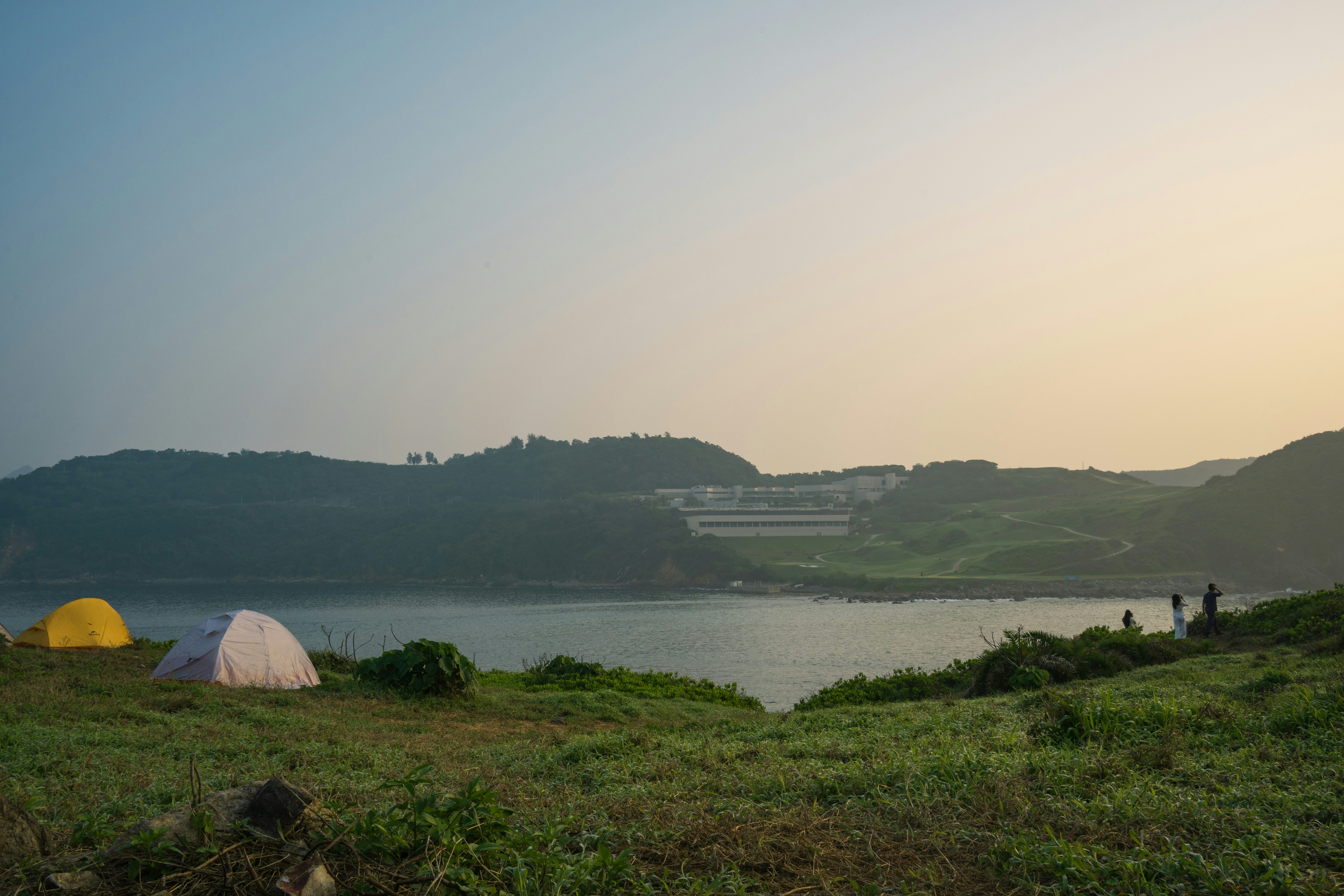 Quiet Riverside Camp on a Dusk-Tinted Hill
