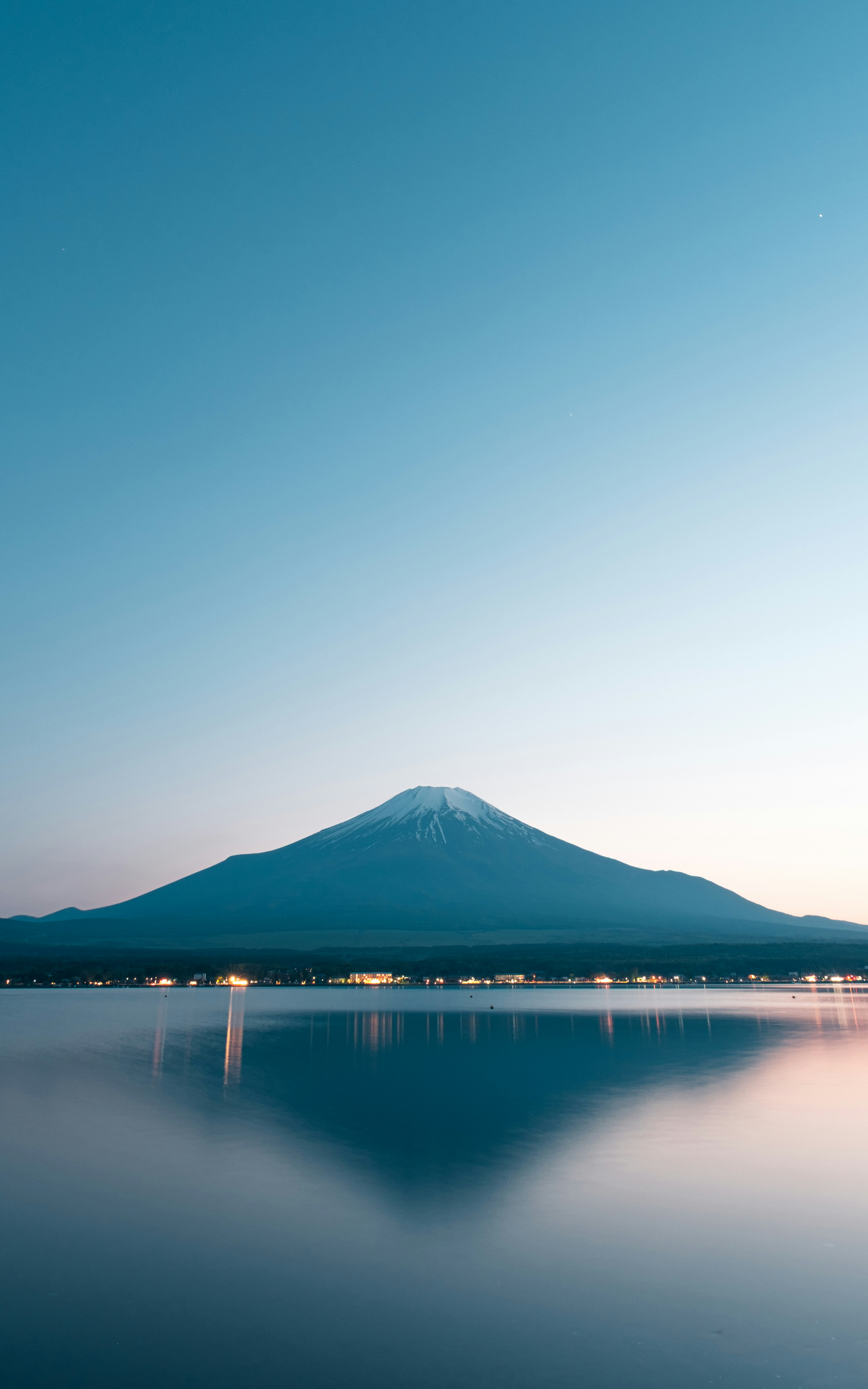 Mt. Fuji at Dusk: A Serene Mirror Across Quiet Waters