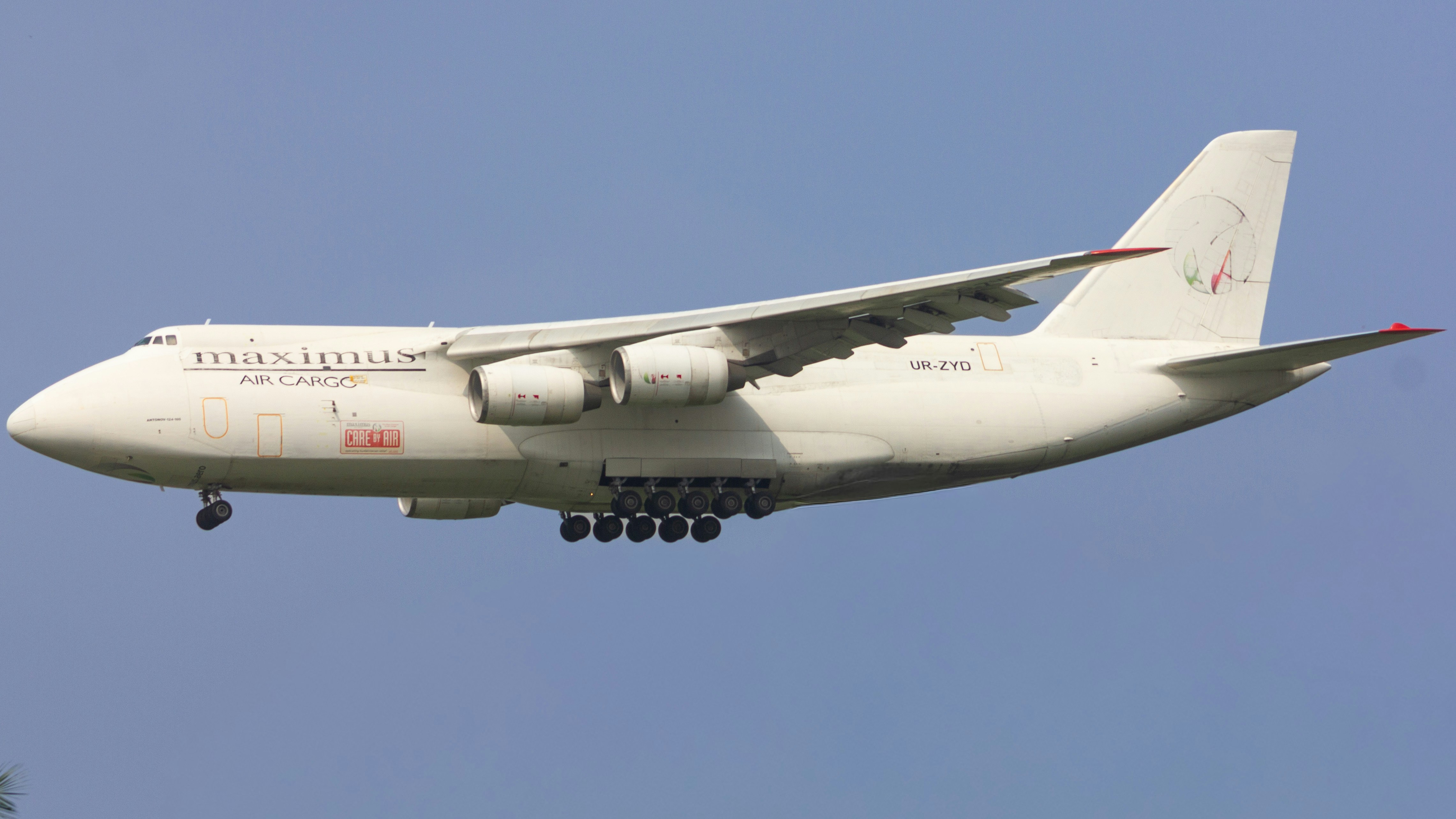 Majestic Freighter in Flight: Aerial Giants Crossing the Sky