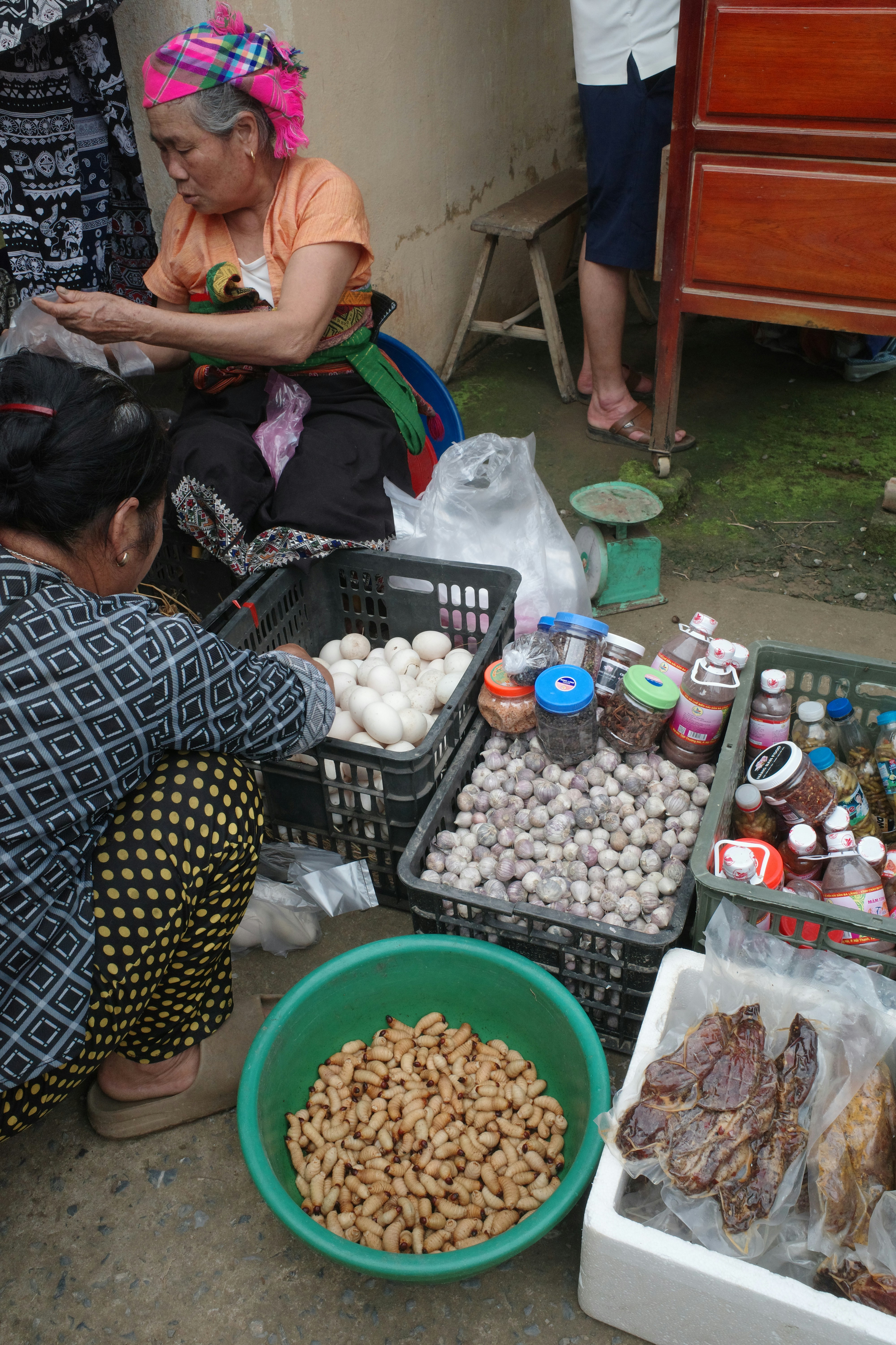 Market Scene: Eggs, Nuts, and Bottled Goods in a Bustling Stall