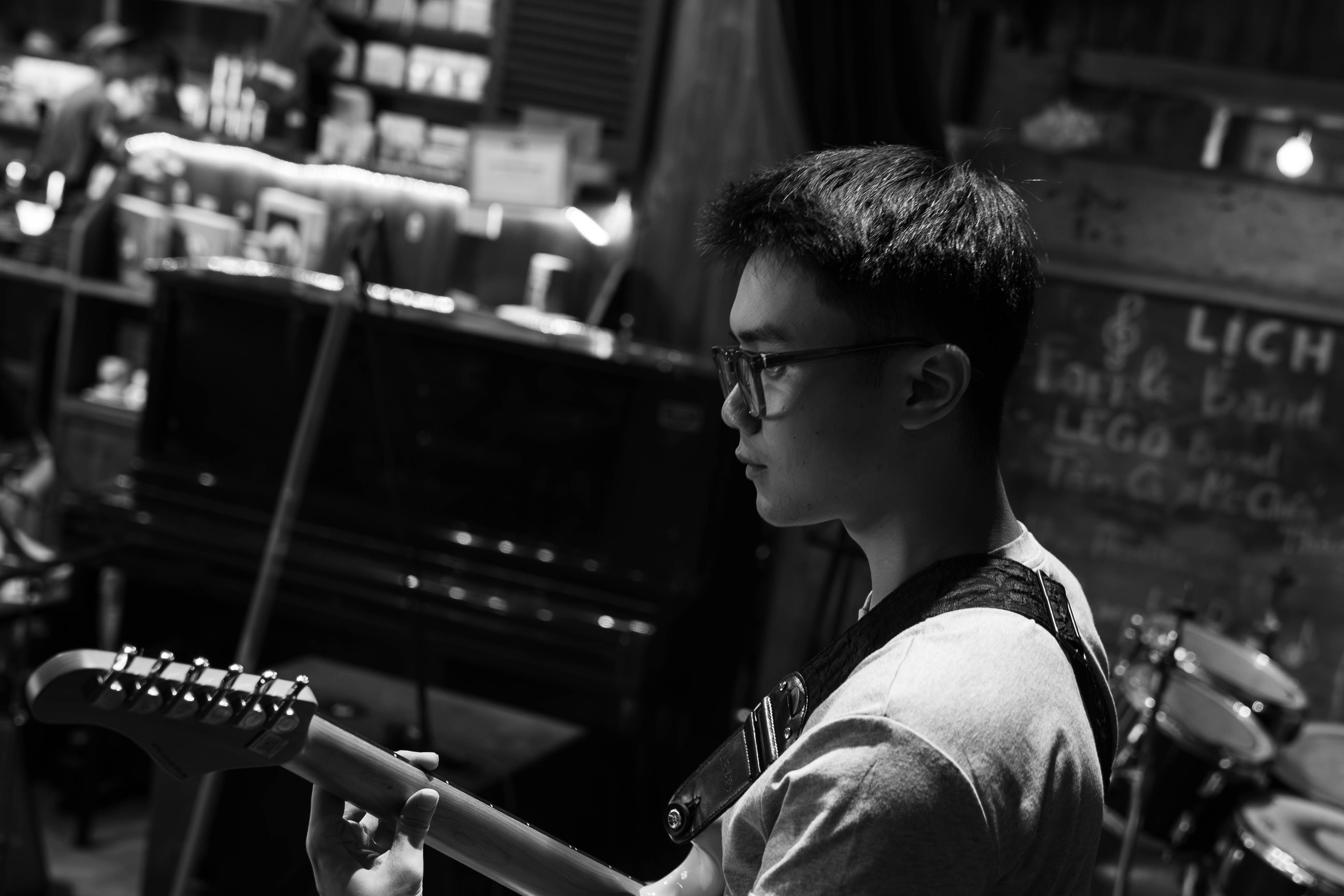 Midnight Strings: A Guitarist Lost in the Workshop Glow