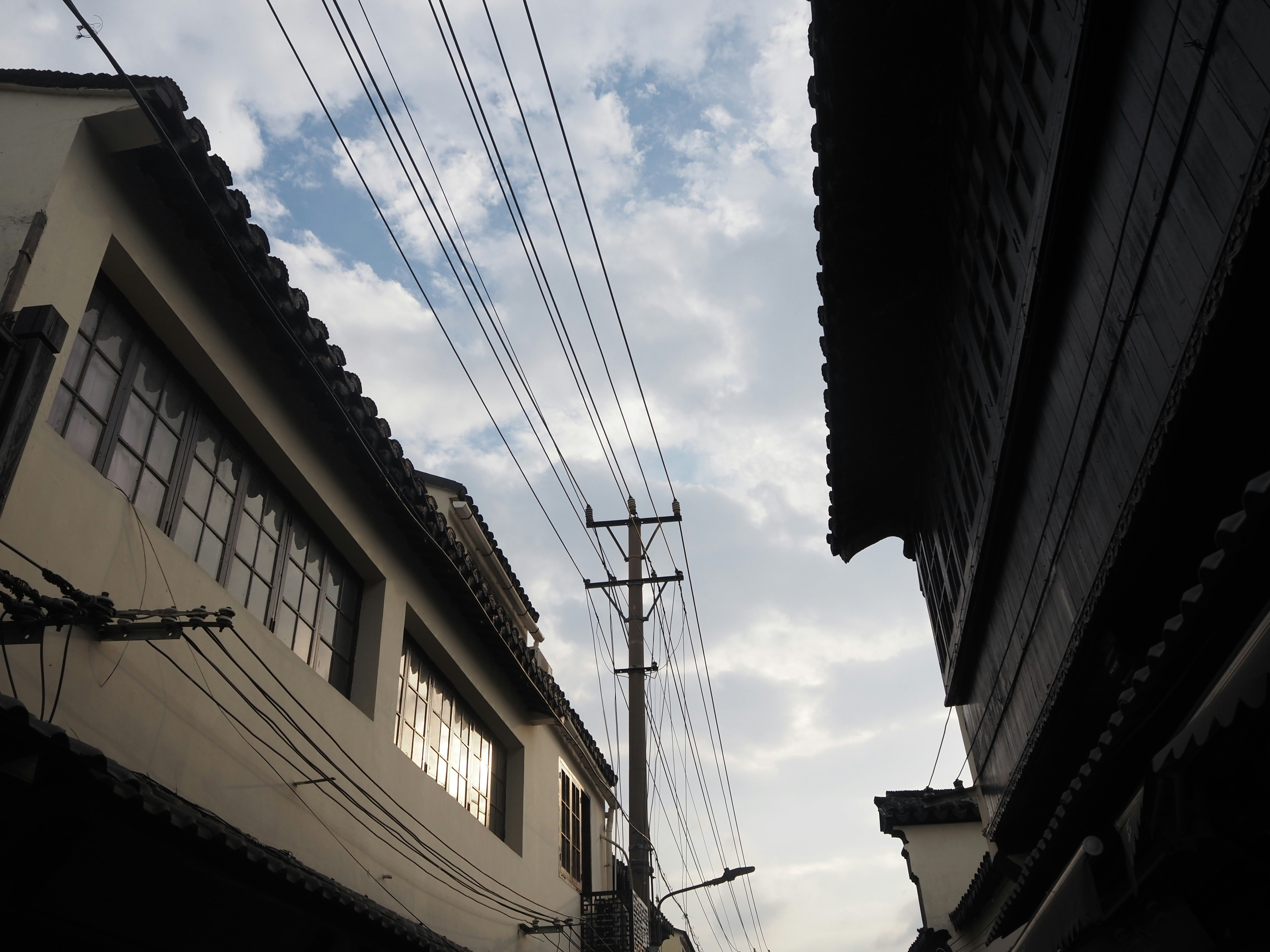 Urban Canyon: Narrow Street Between Shadowed Walls