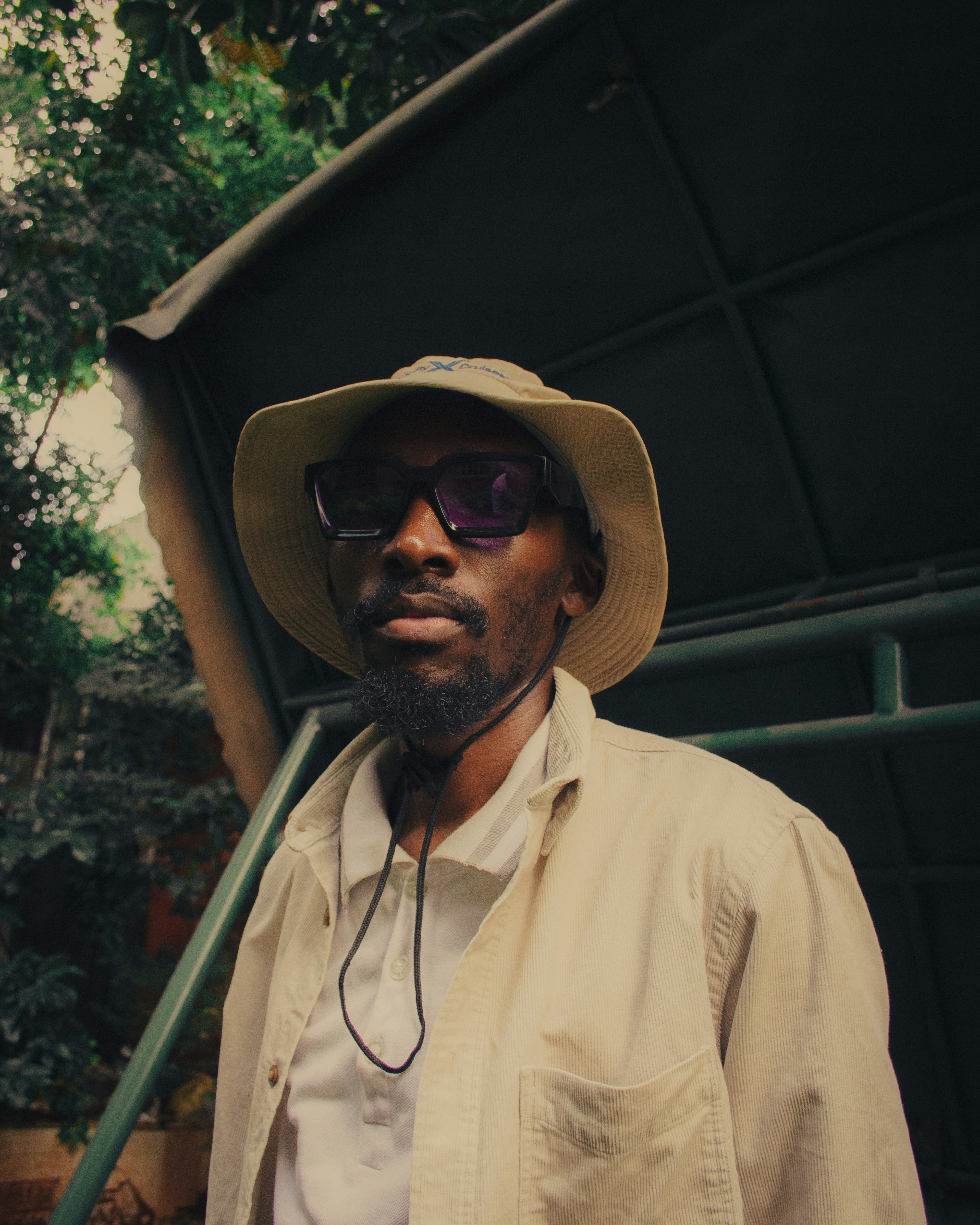 Wide-brimmed Quietude: A Portrait in Dappled Light