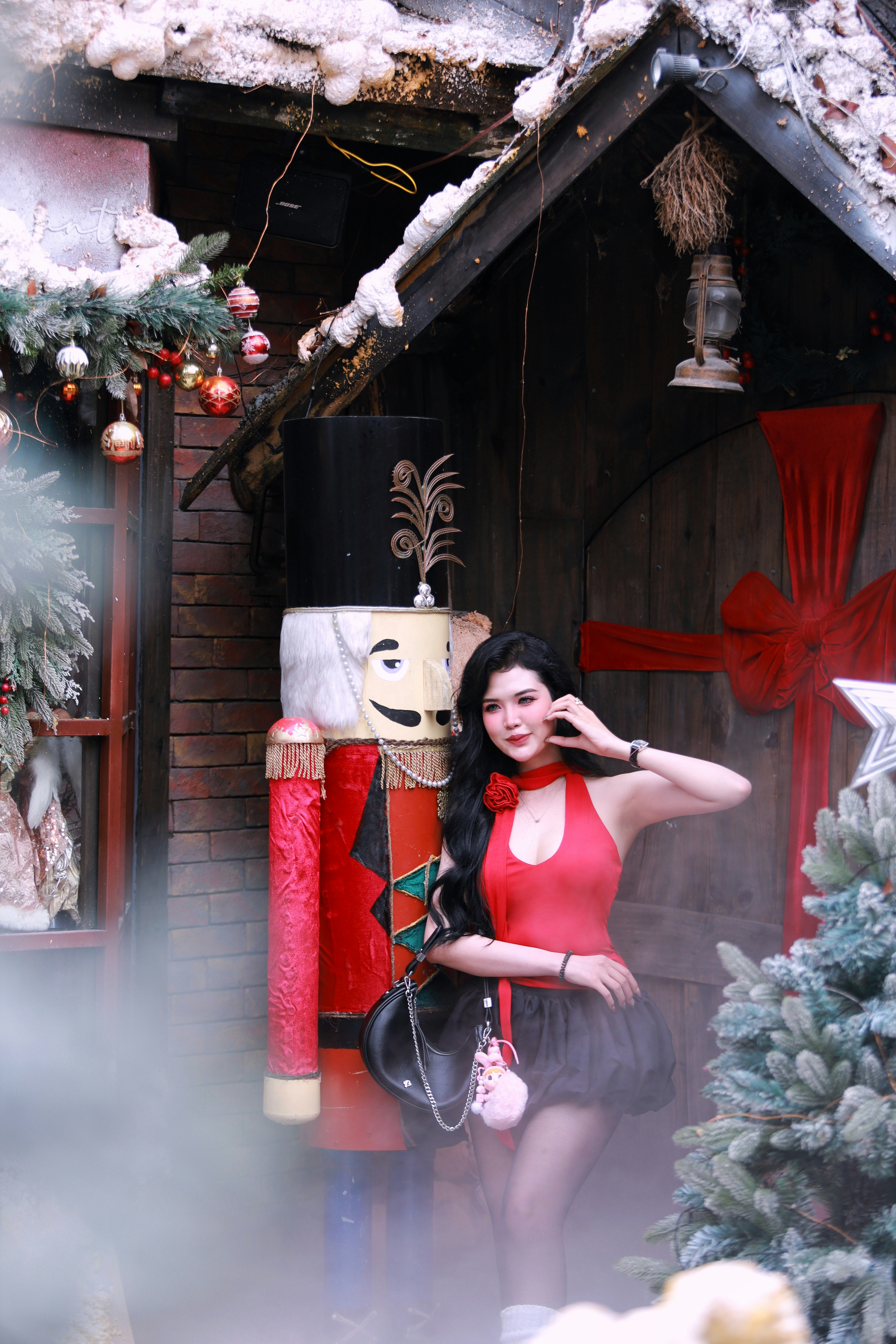 Festive Portrait by the Nutcracker in Soft Winter Mist