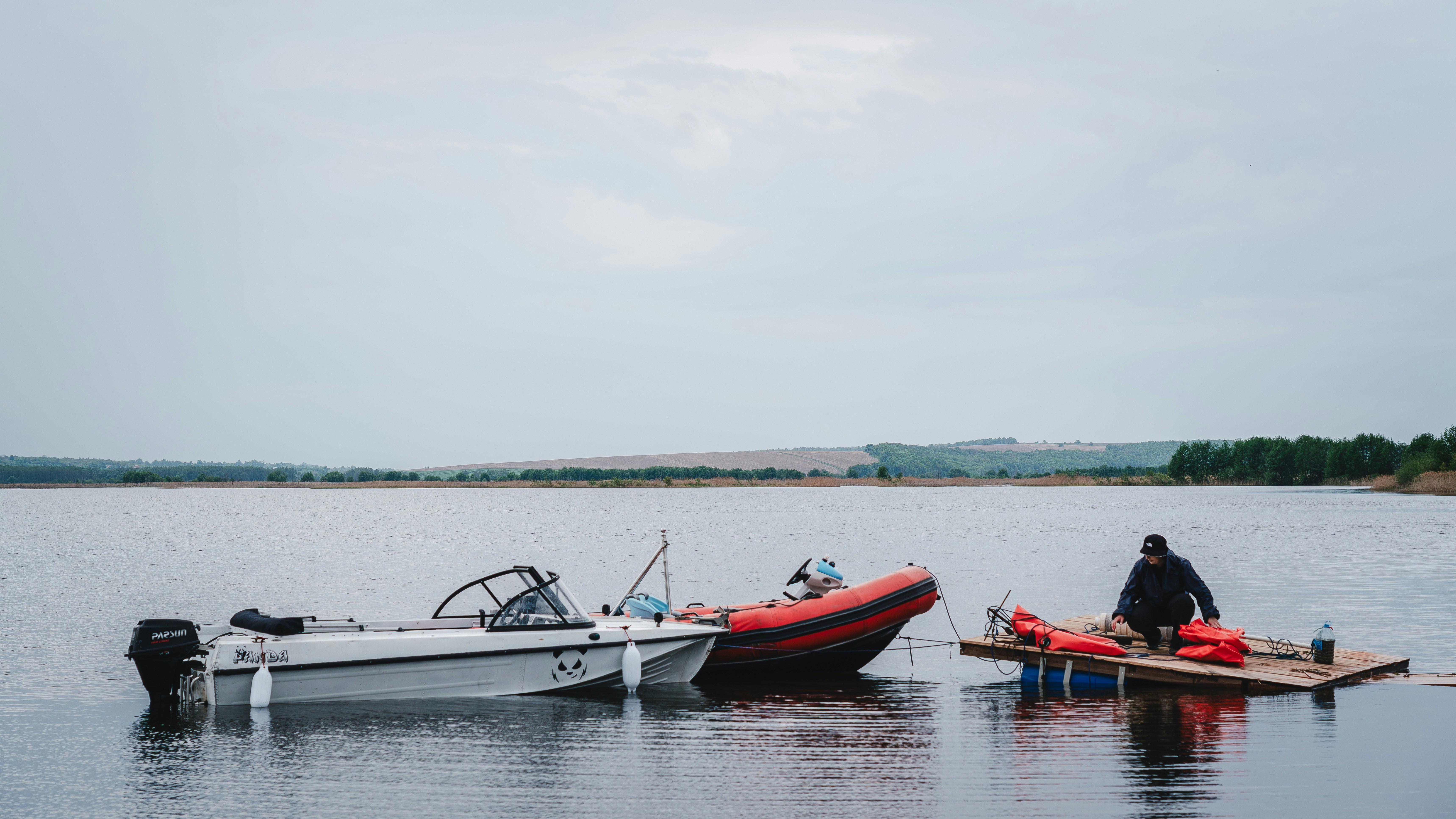 Calm Confluence: Boats and Banished Wake on a Quiet River
