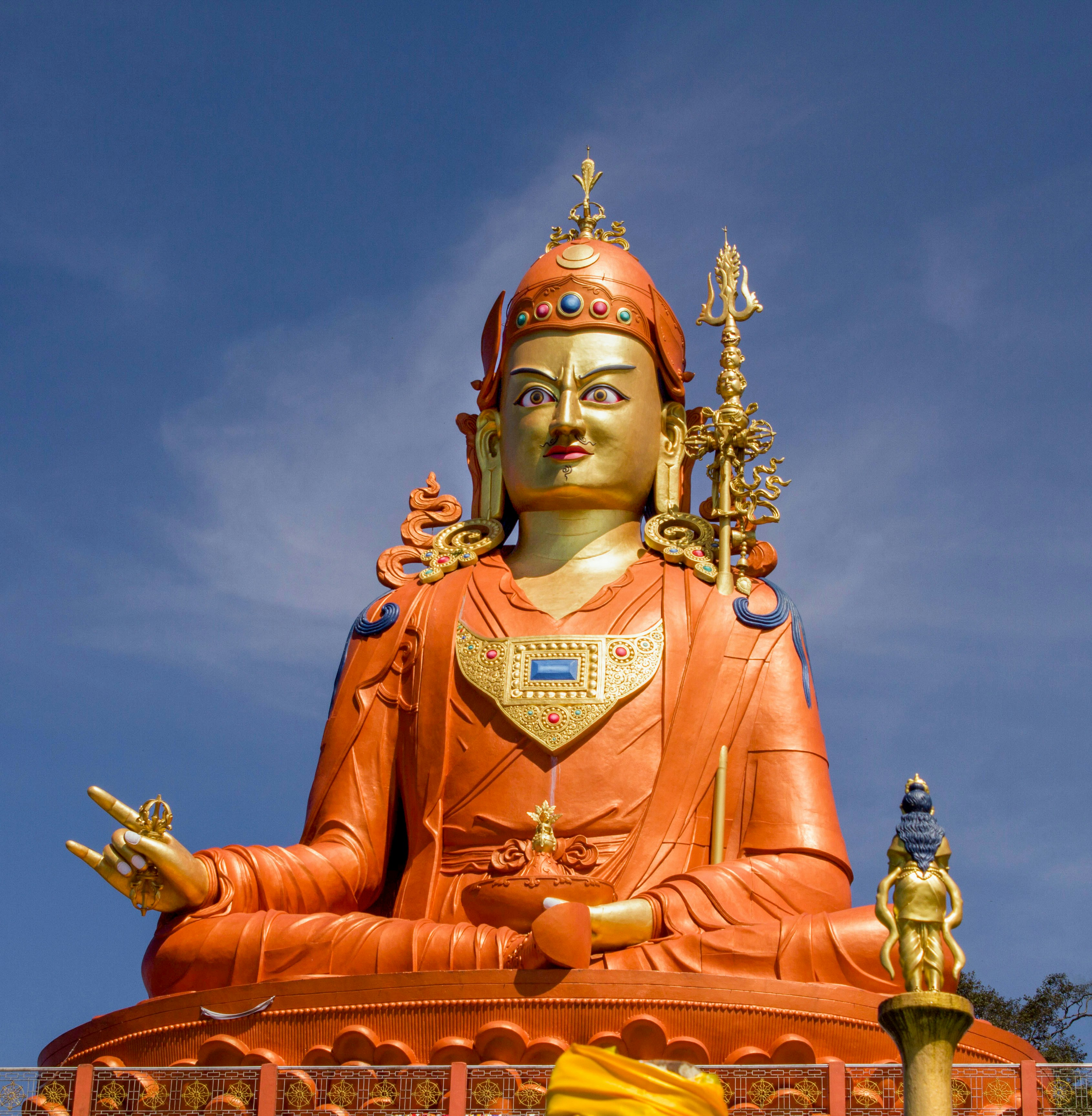 Portrait of a Golden Bodhisattva: Tranquil Majesty Under a Blue Sky