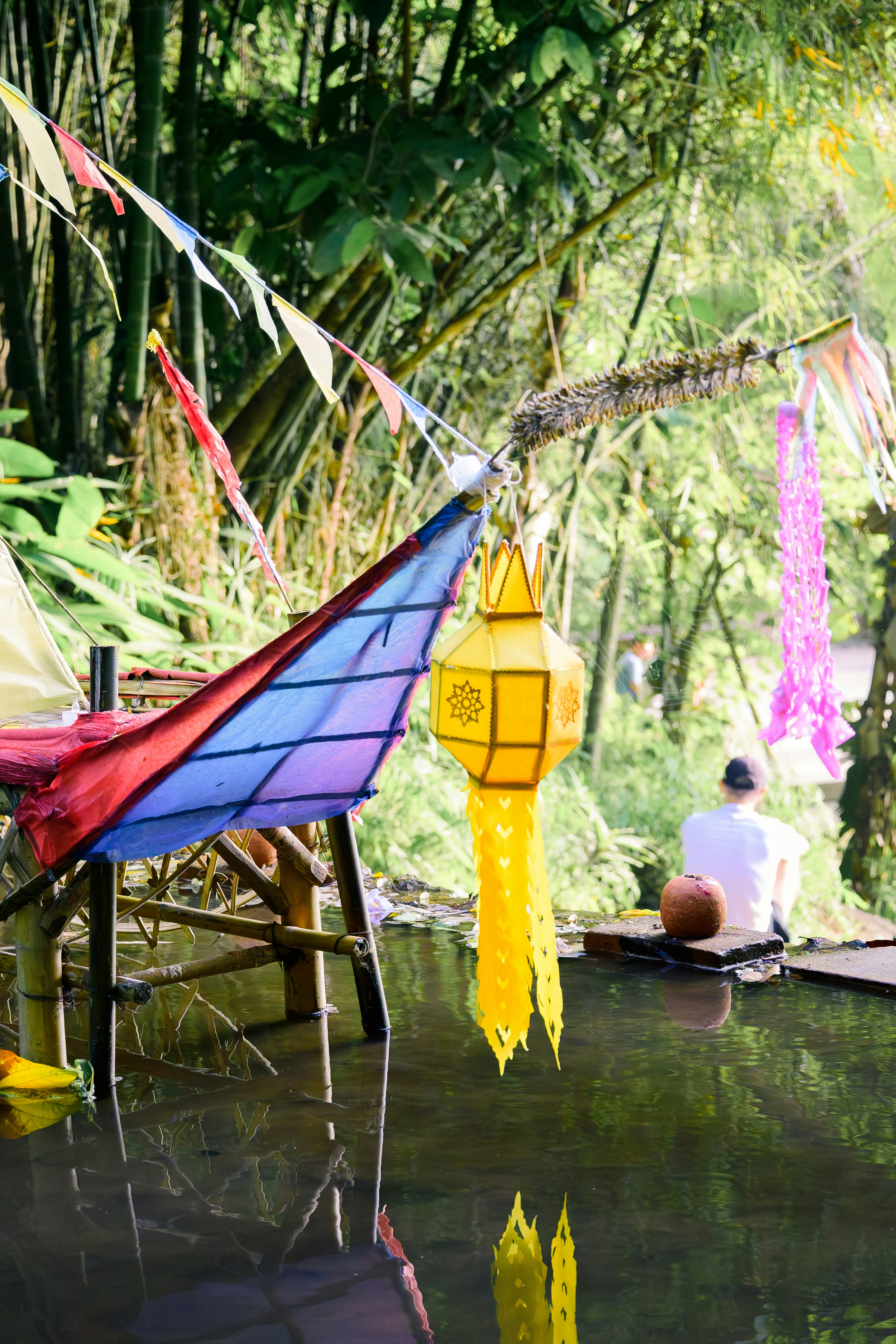 Floating Lanterns and Colorful Canopy by the Water