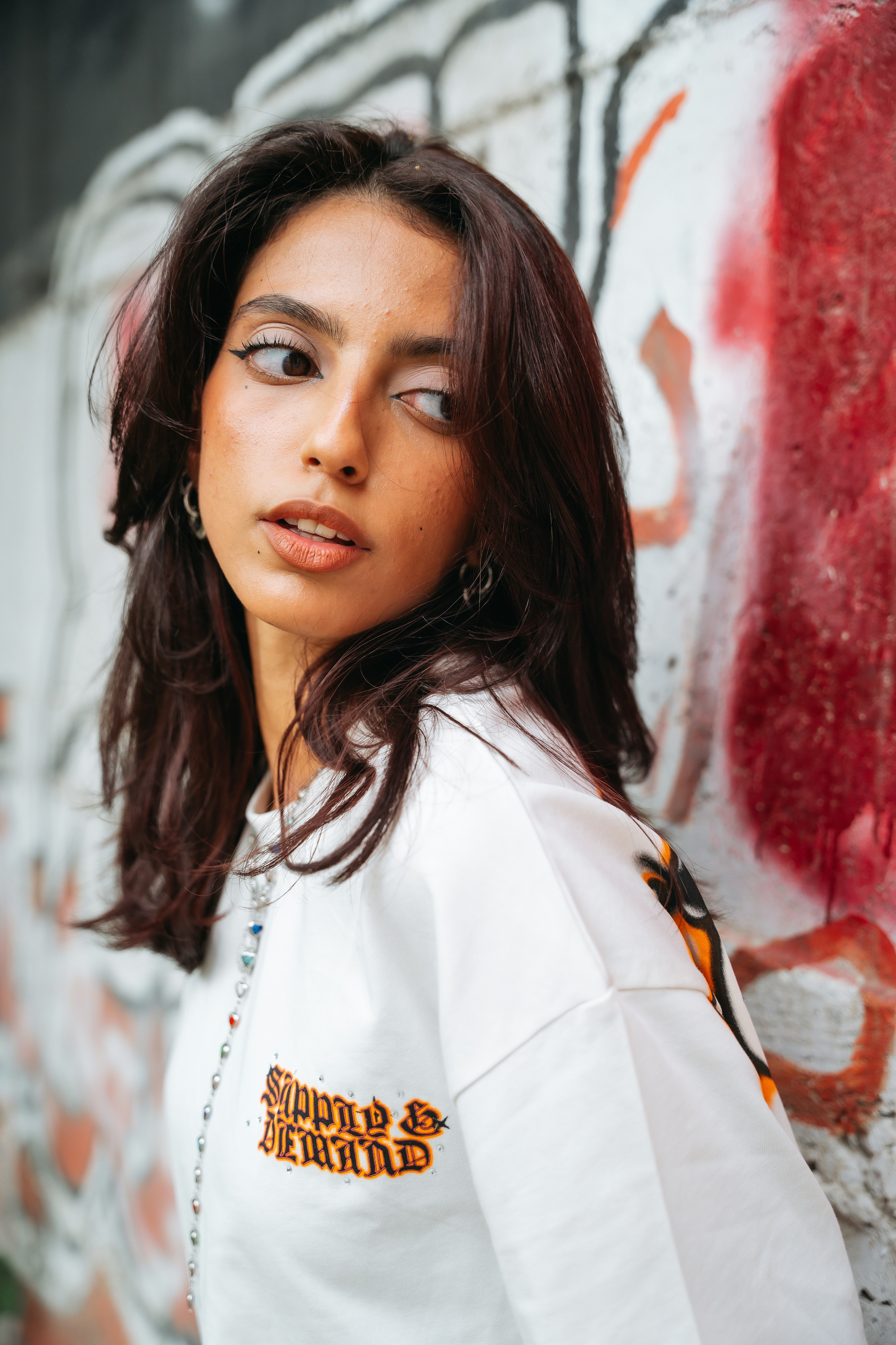 Graffiti Wall Portrait: a thoughtful glance along urban textures