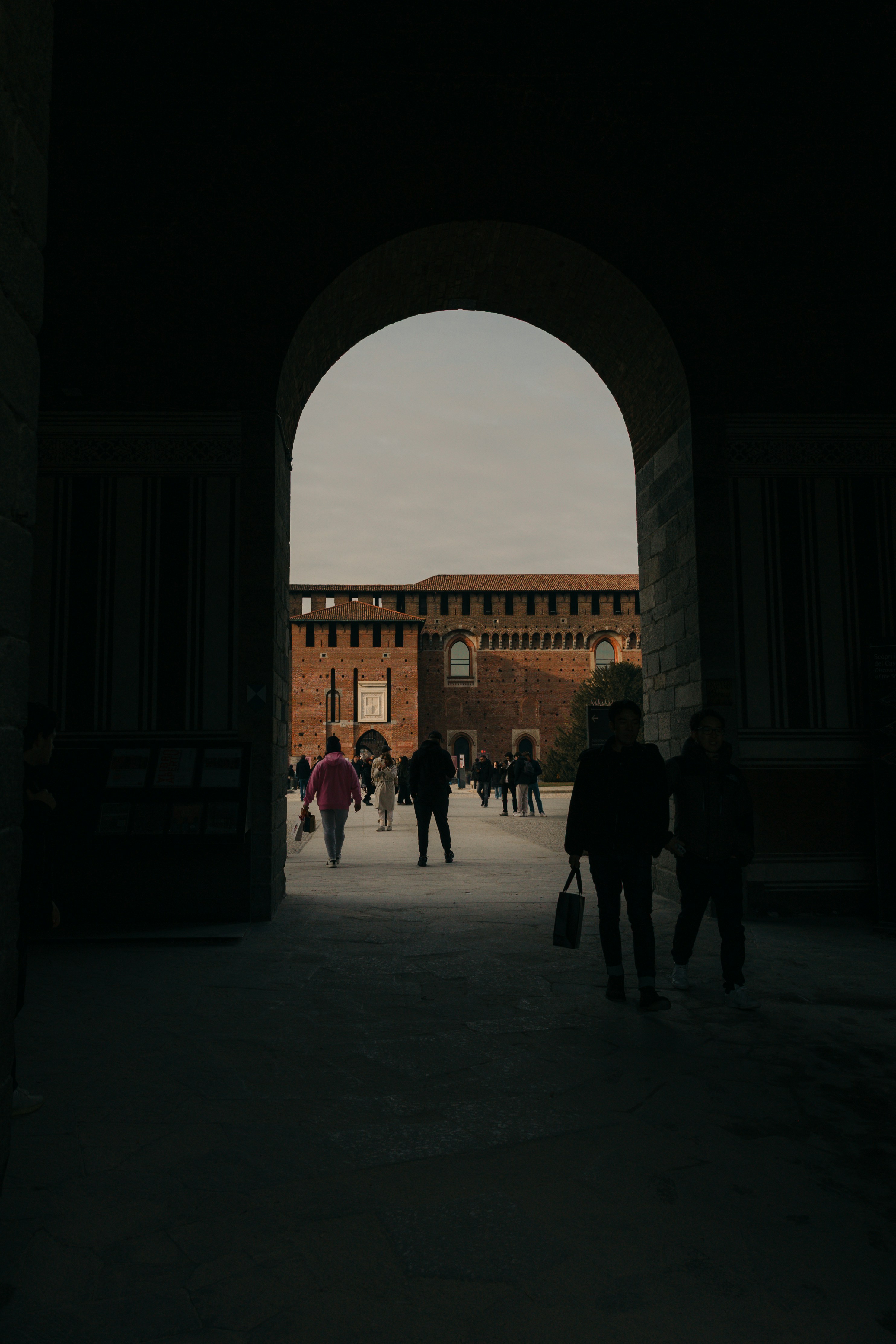 Through the Portal: Quiet Pathway to the Sunlit Courtyard