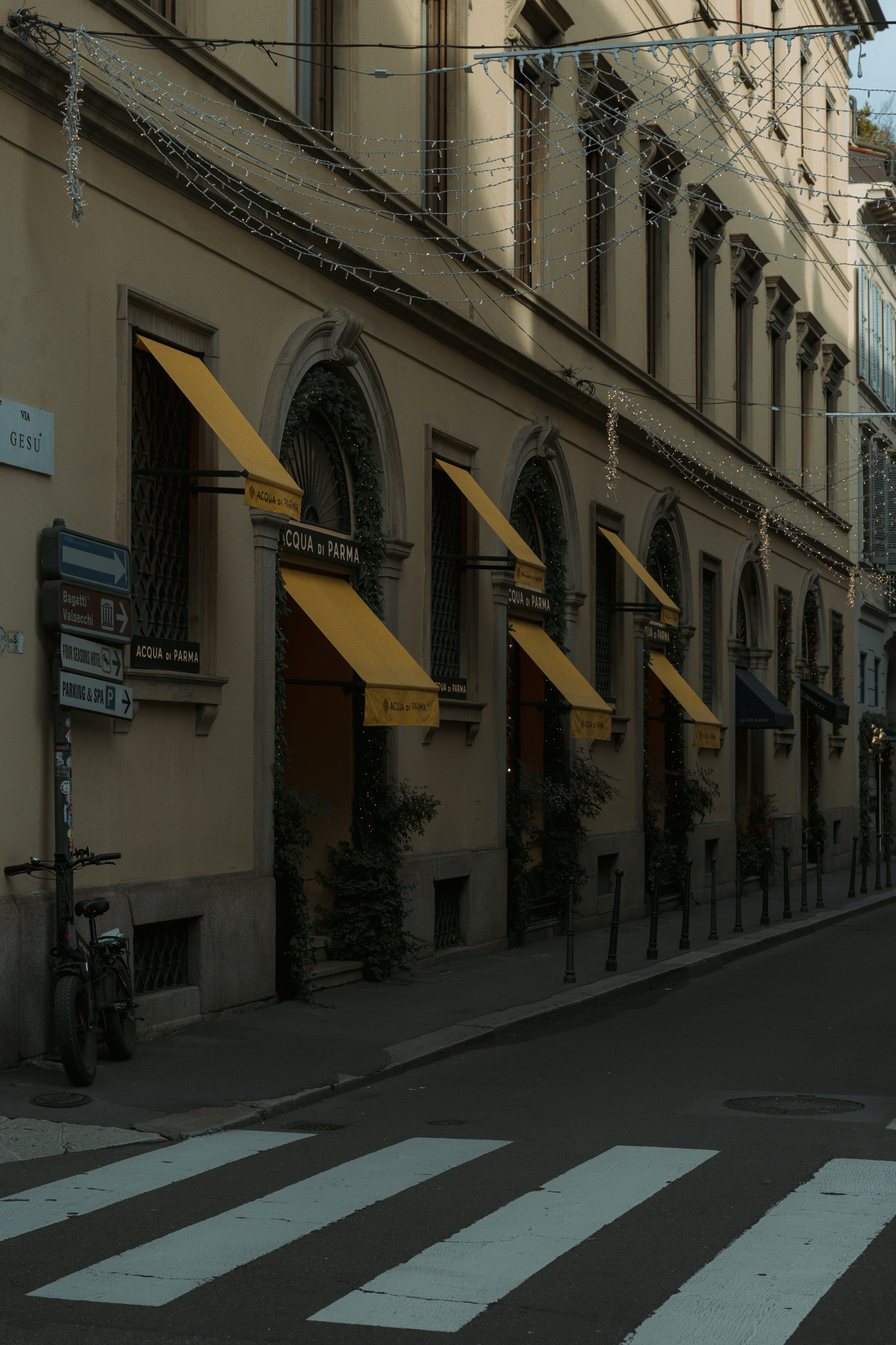 Yellow Awnings and String Lights Over a Quiet Street