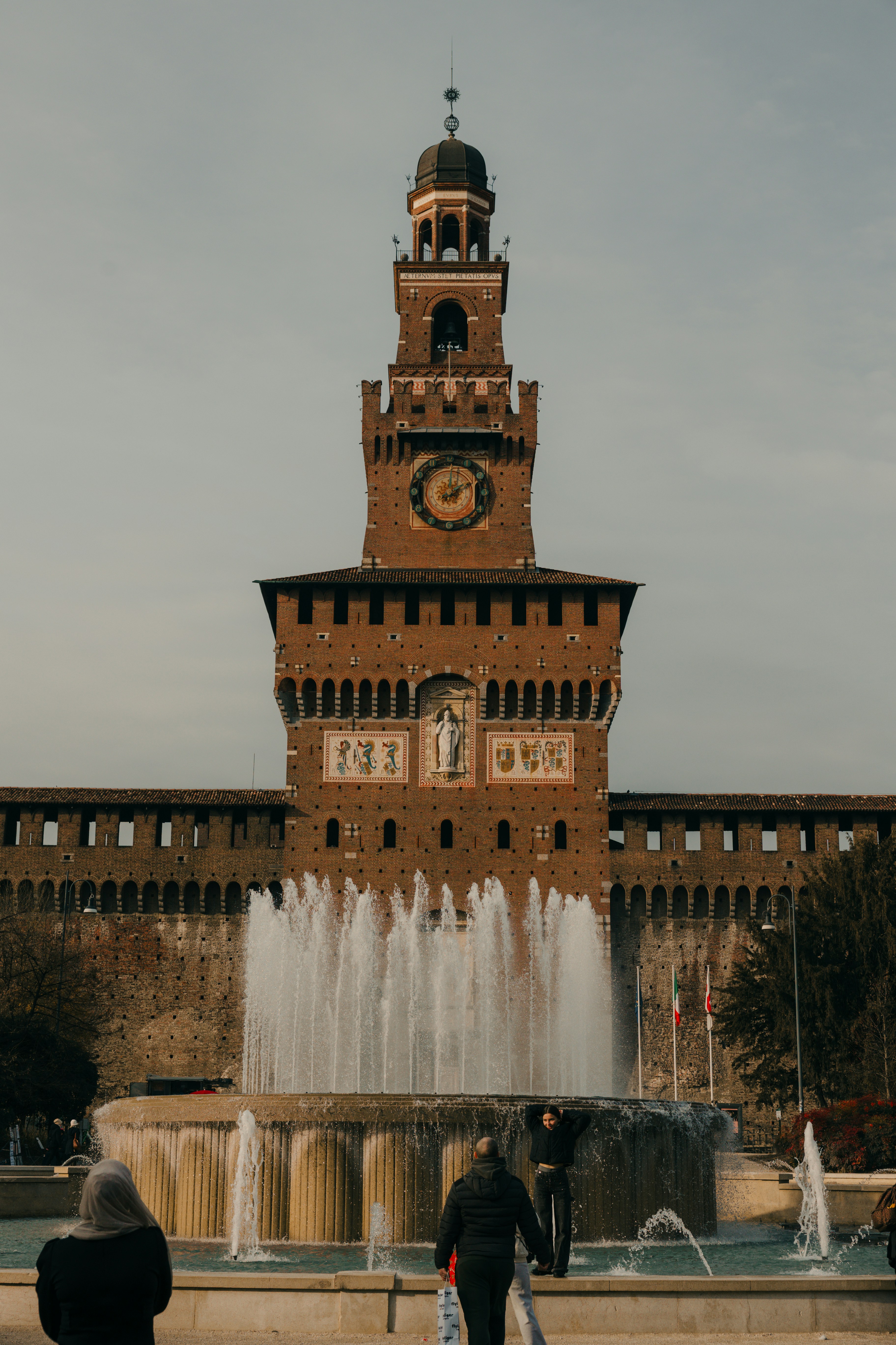 Clocktower on the Brick Fortress: Water Jets at the Piazza