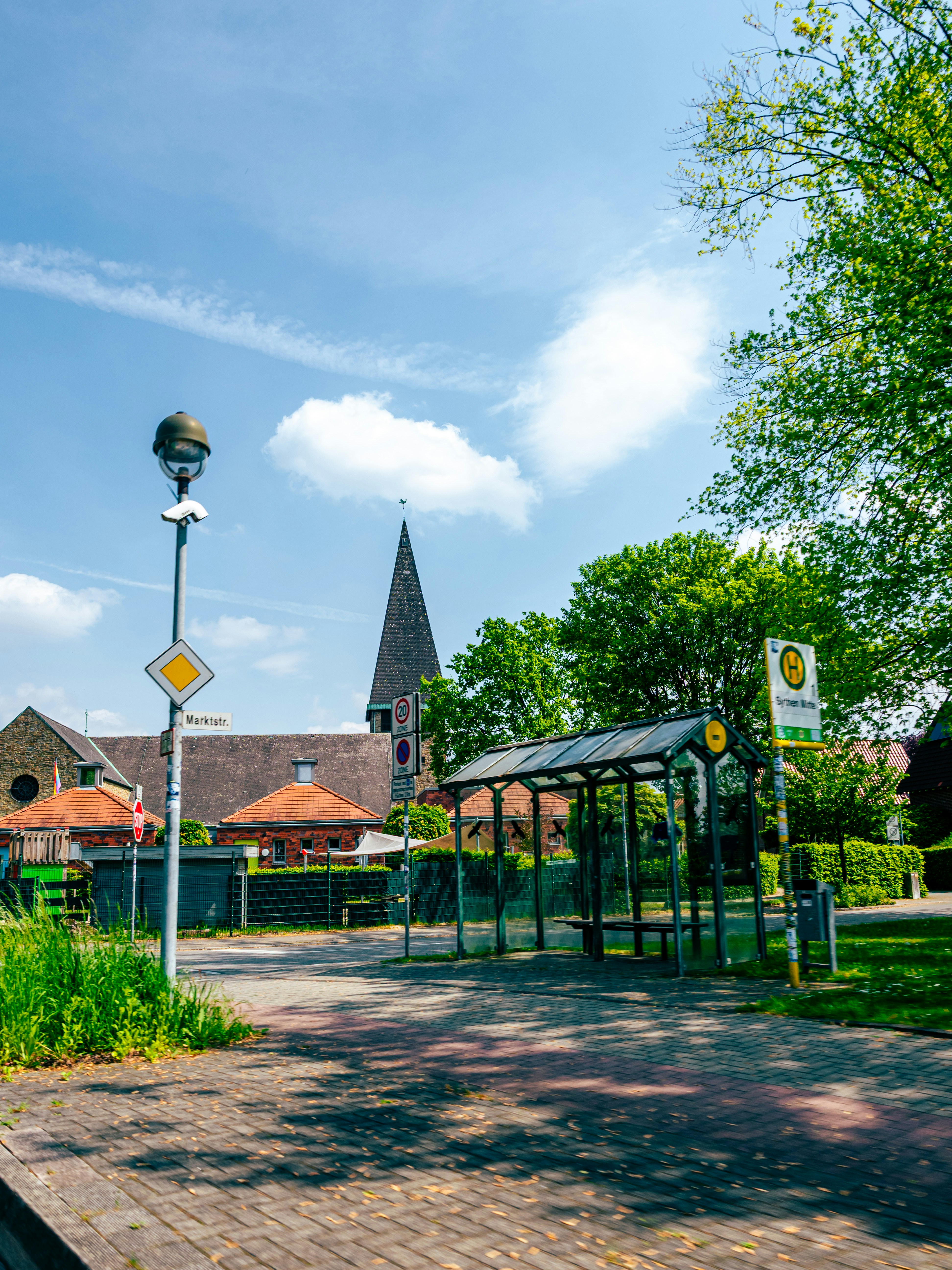 Sunlit Communal Square with Gazebo and Spire