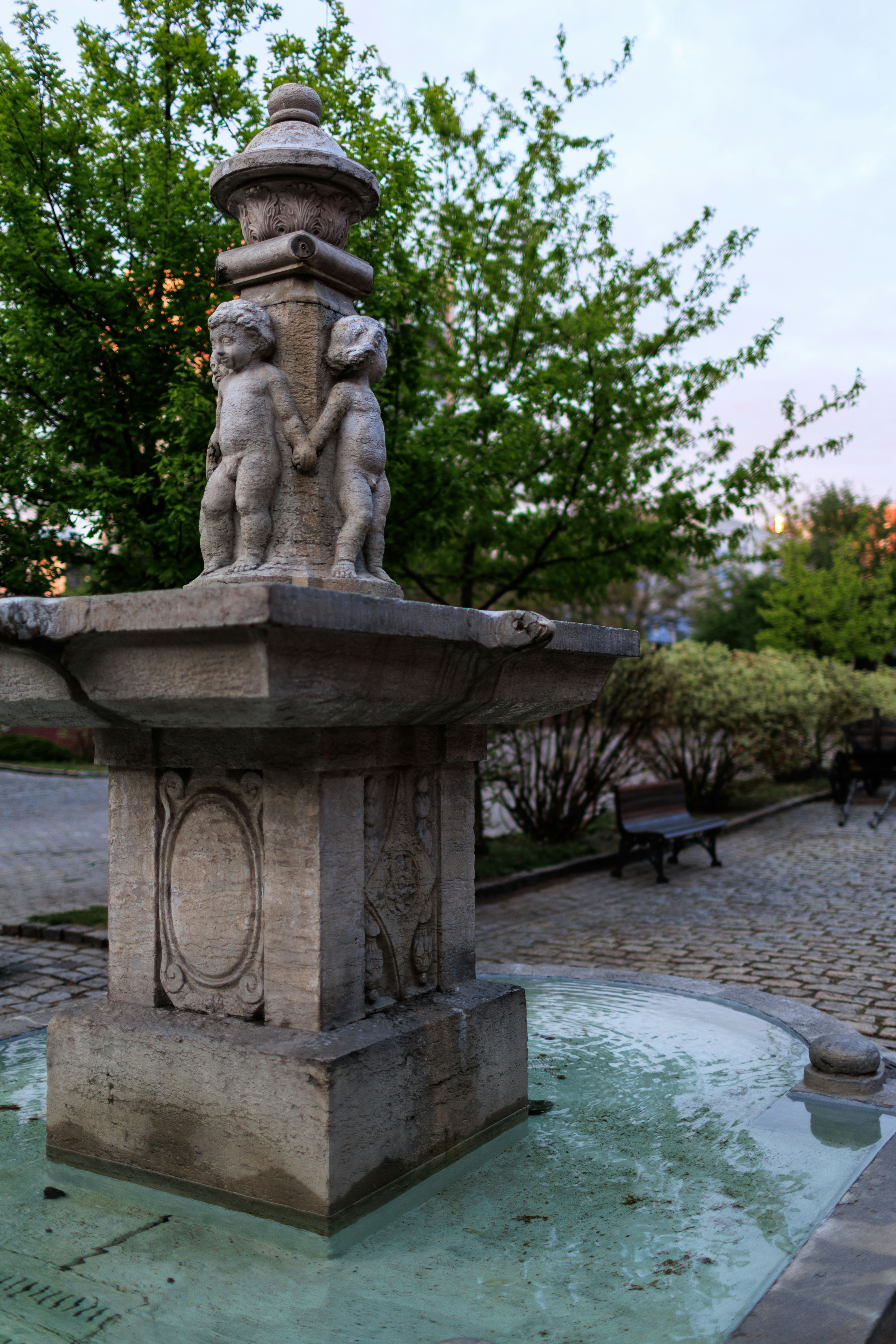 Stone Cherubs Guarding the Quiet Fountain