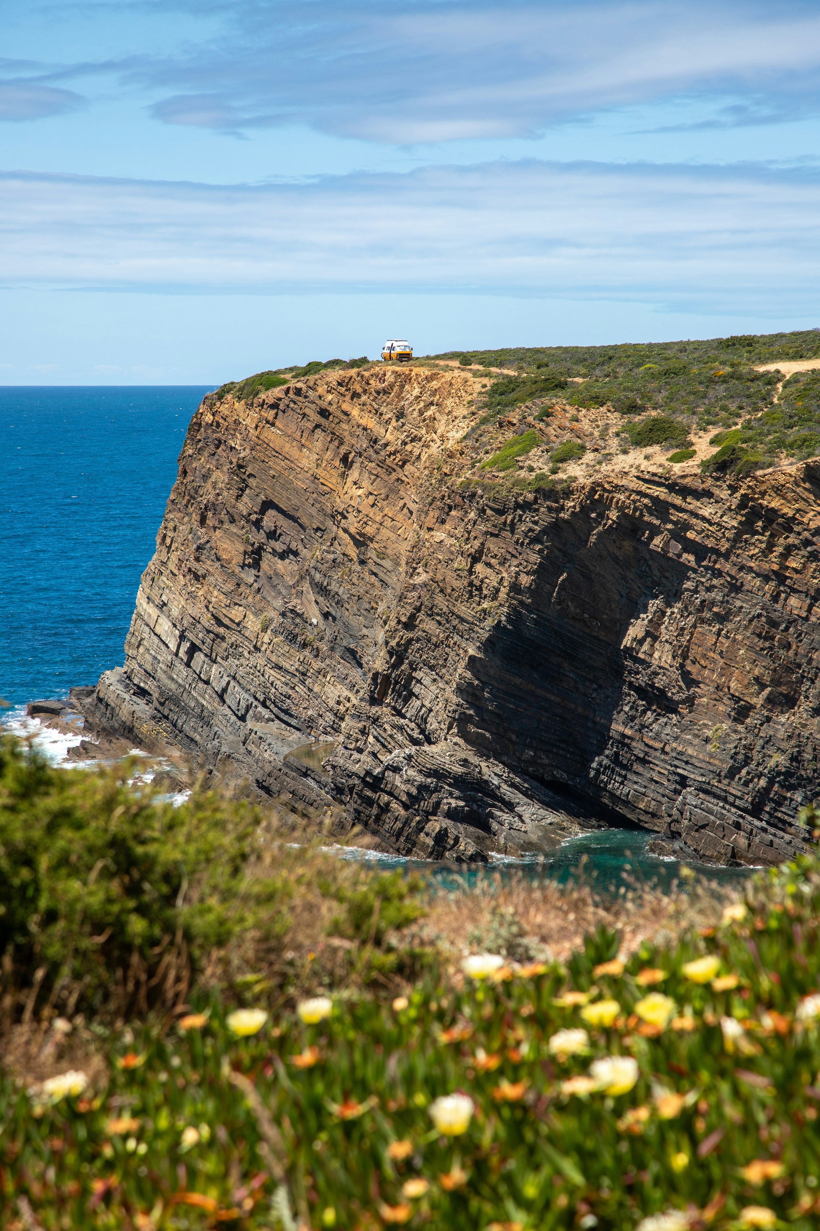Cliff-top Lighthouse of Distant Blue