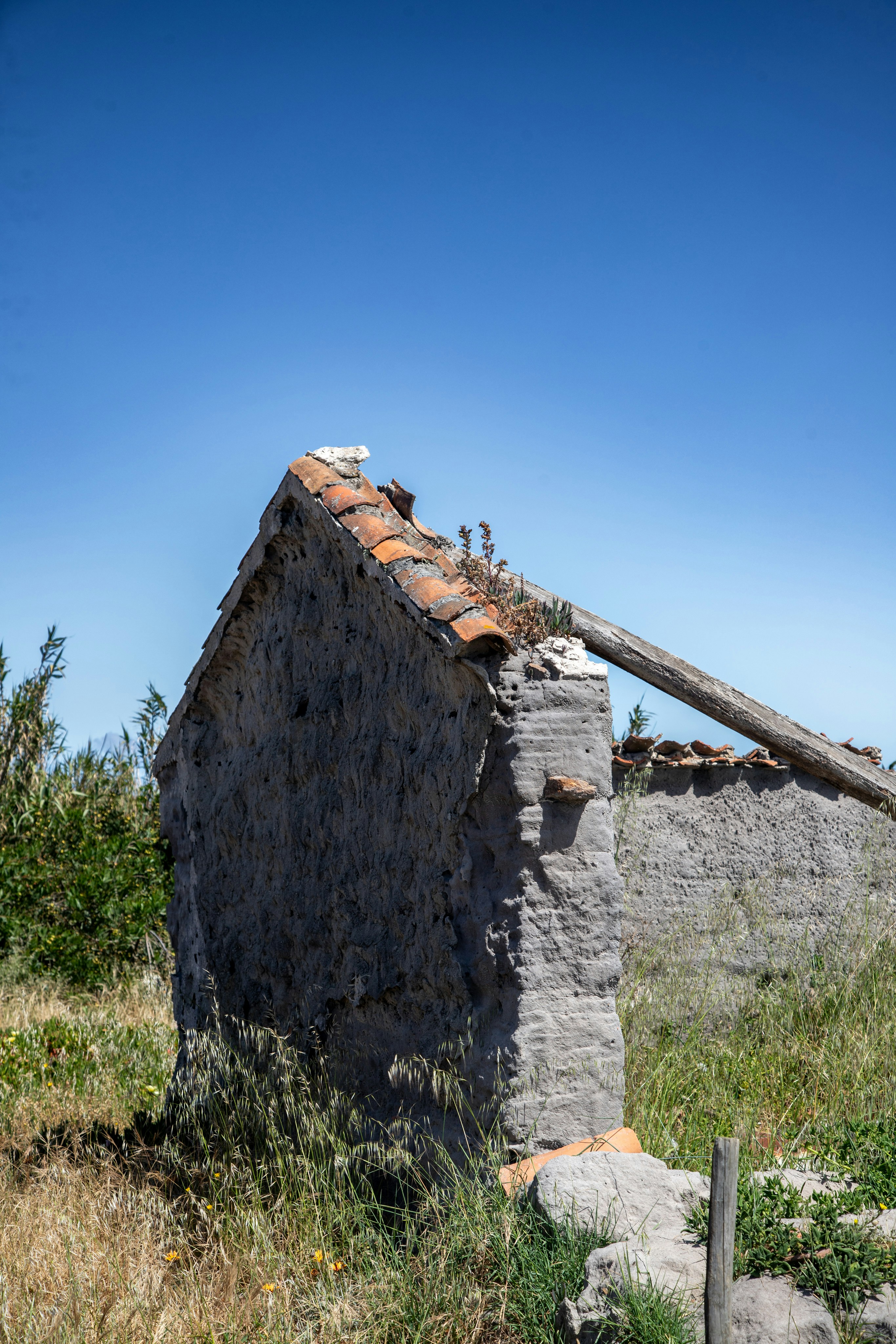 Ruined Stone Shelter under a Clear Blue Sky