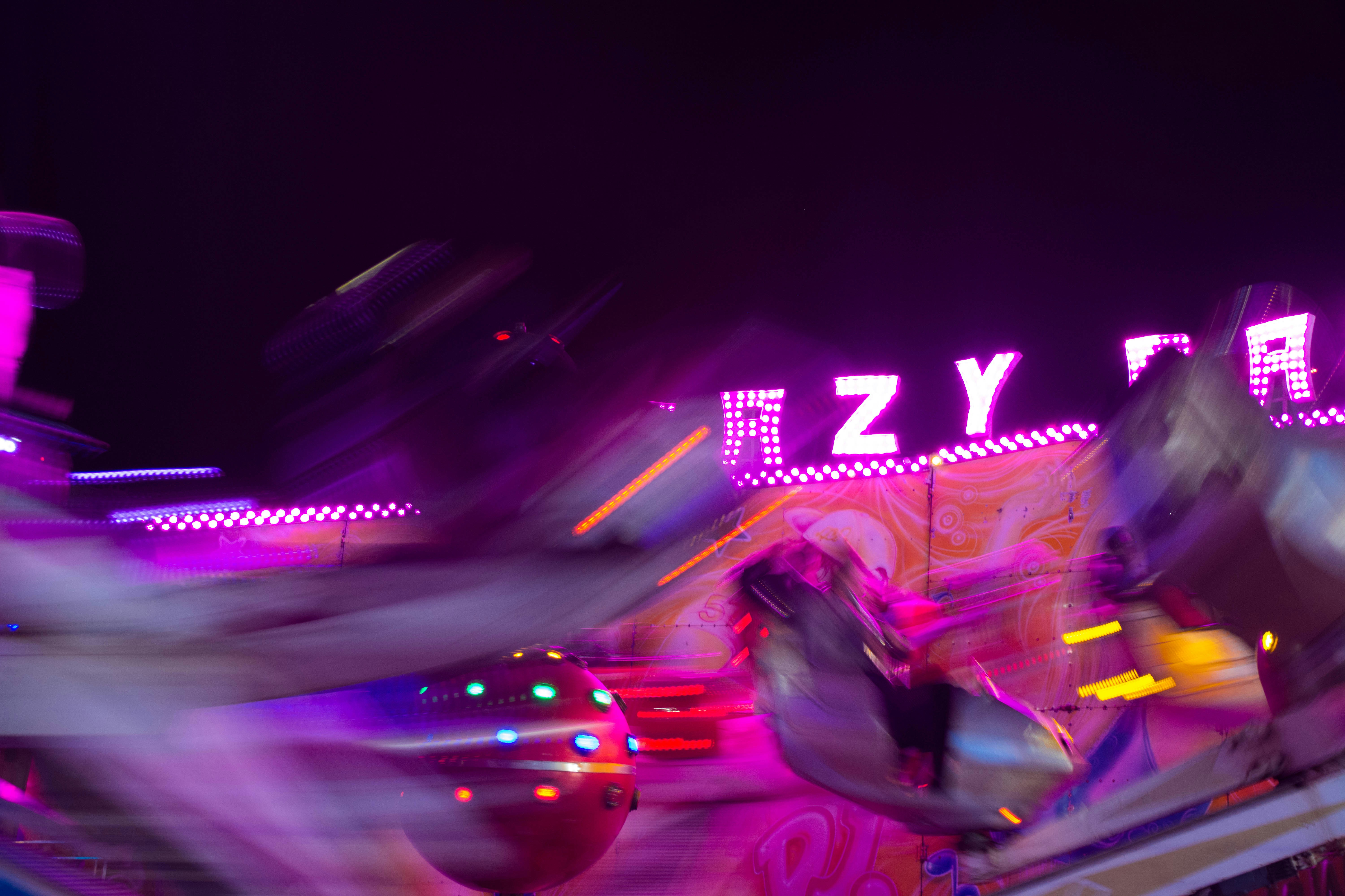 Neon Swing: Blurred Carnival Light in Motion
