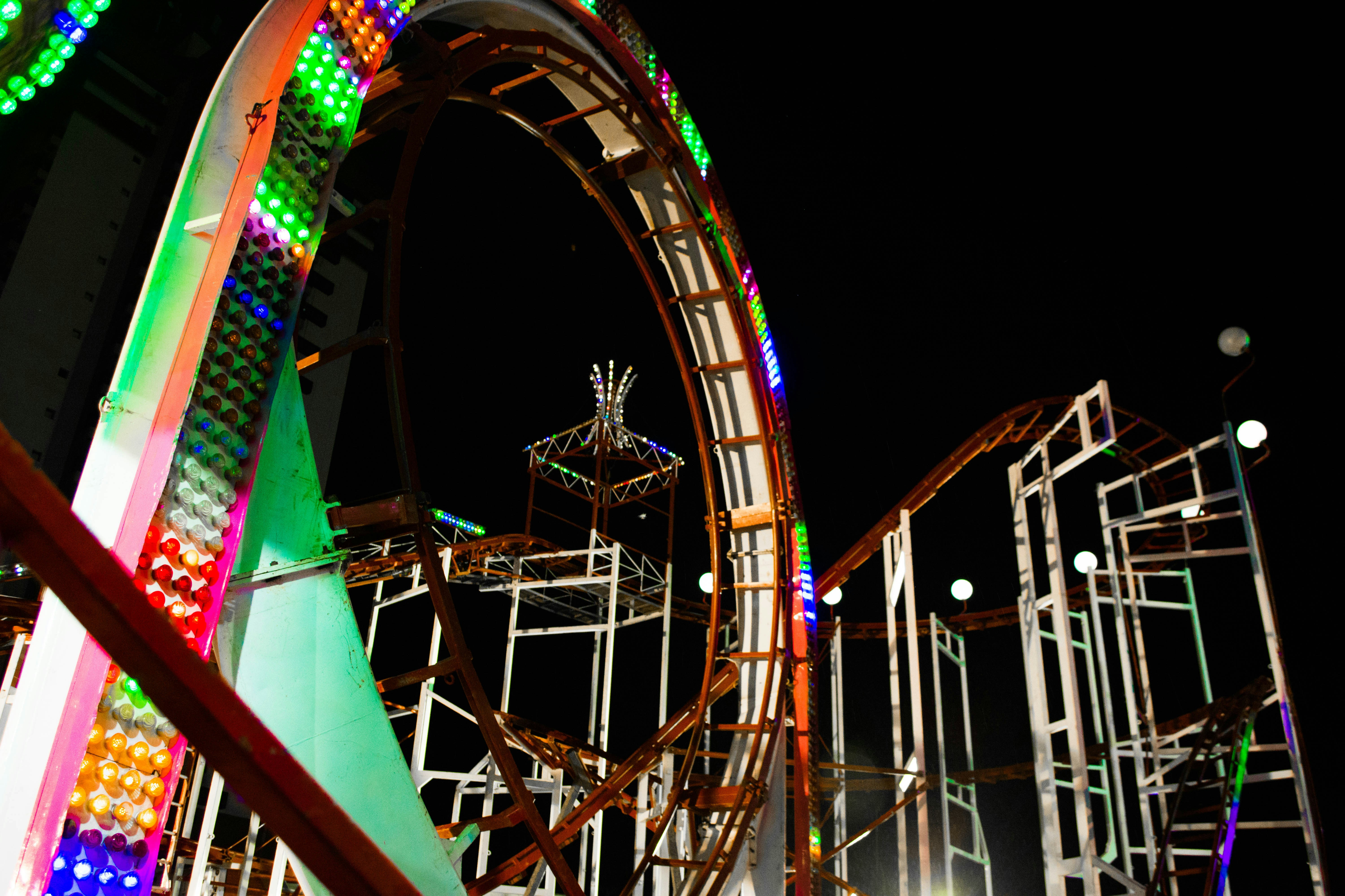 Neon Loop at Night: A Colorful Carousel of Steel and Light