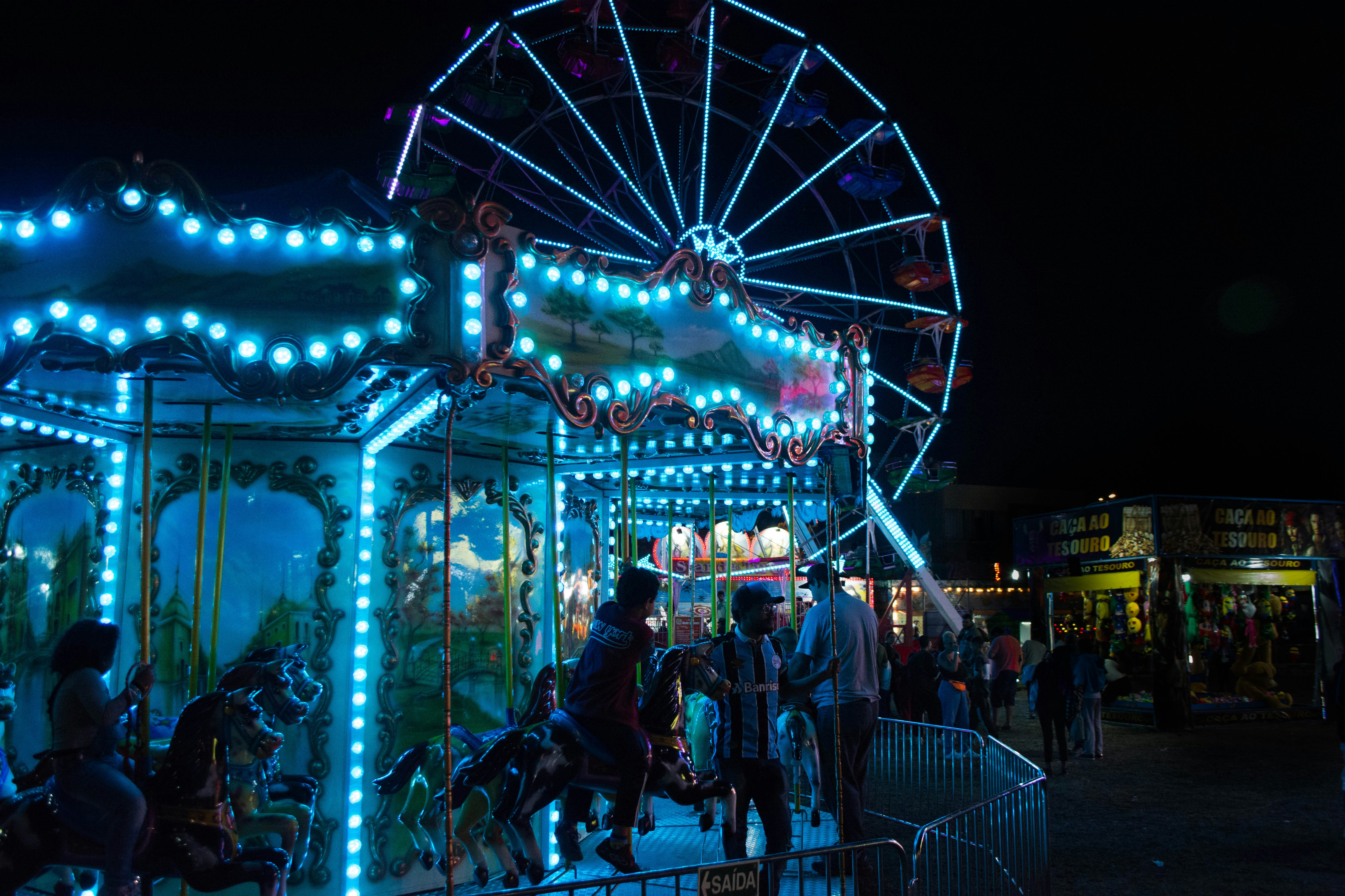 Neon Carousel at Night: A Glimmering Pier of Memories