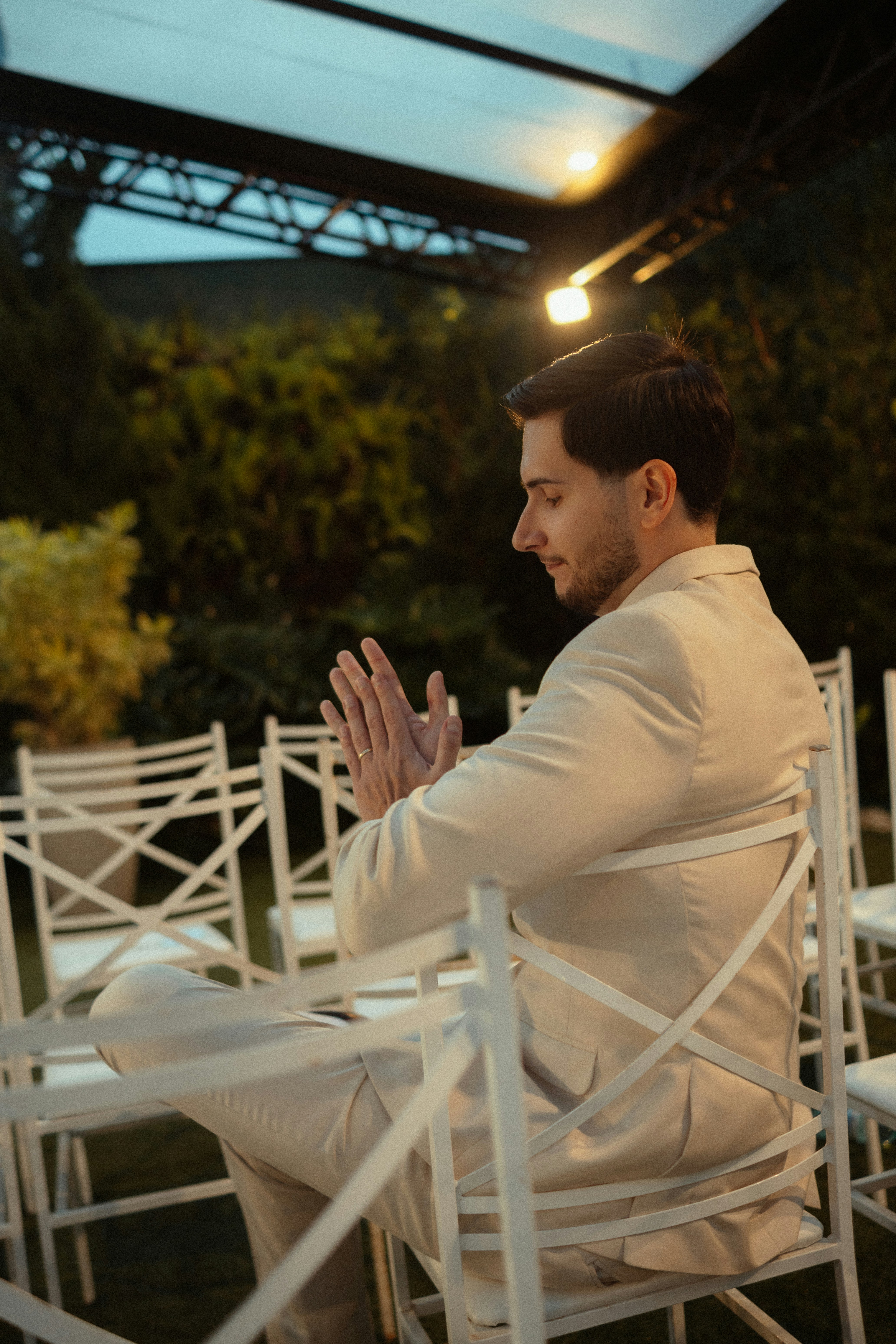 Praying in Light: A Quiet Moment Beneath Evening Canopy
