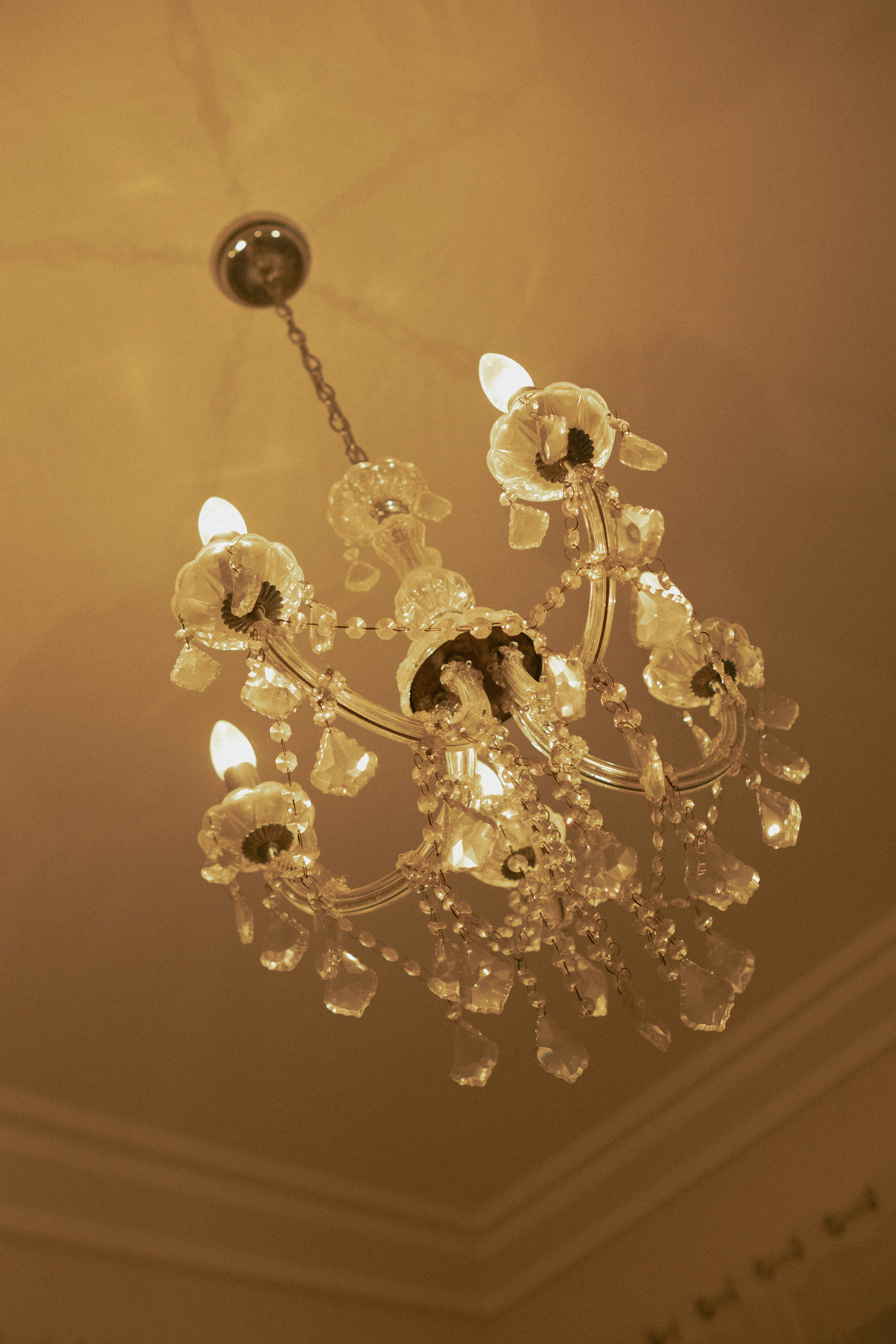 Crystal Crown: A Vintage Chandelier Reaching for the Ceiling