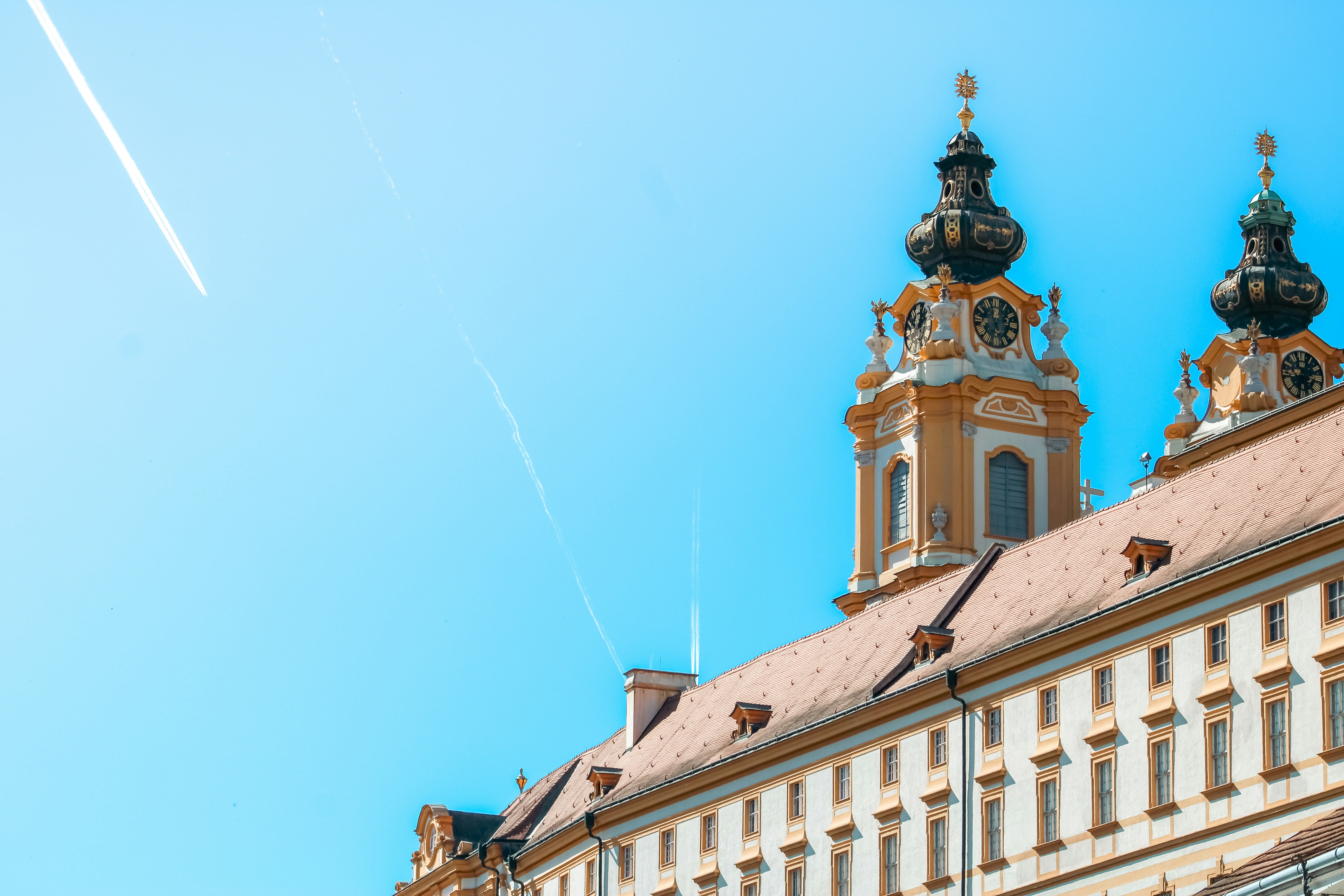 Sunlit Baroque Towers Reach Toward a Clear Sky
