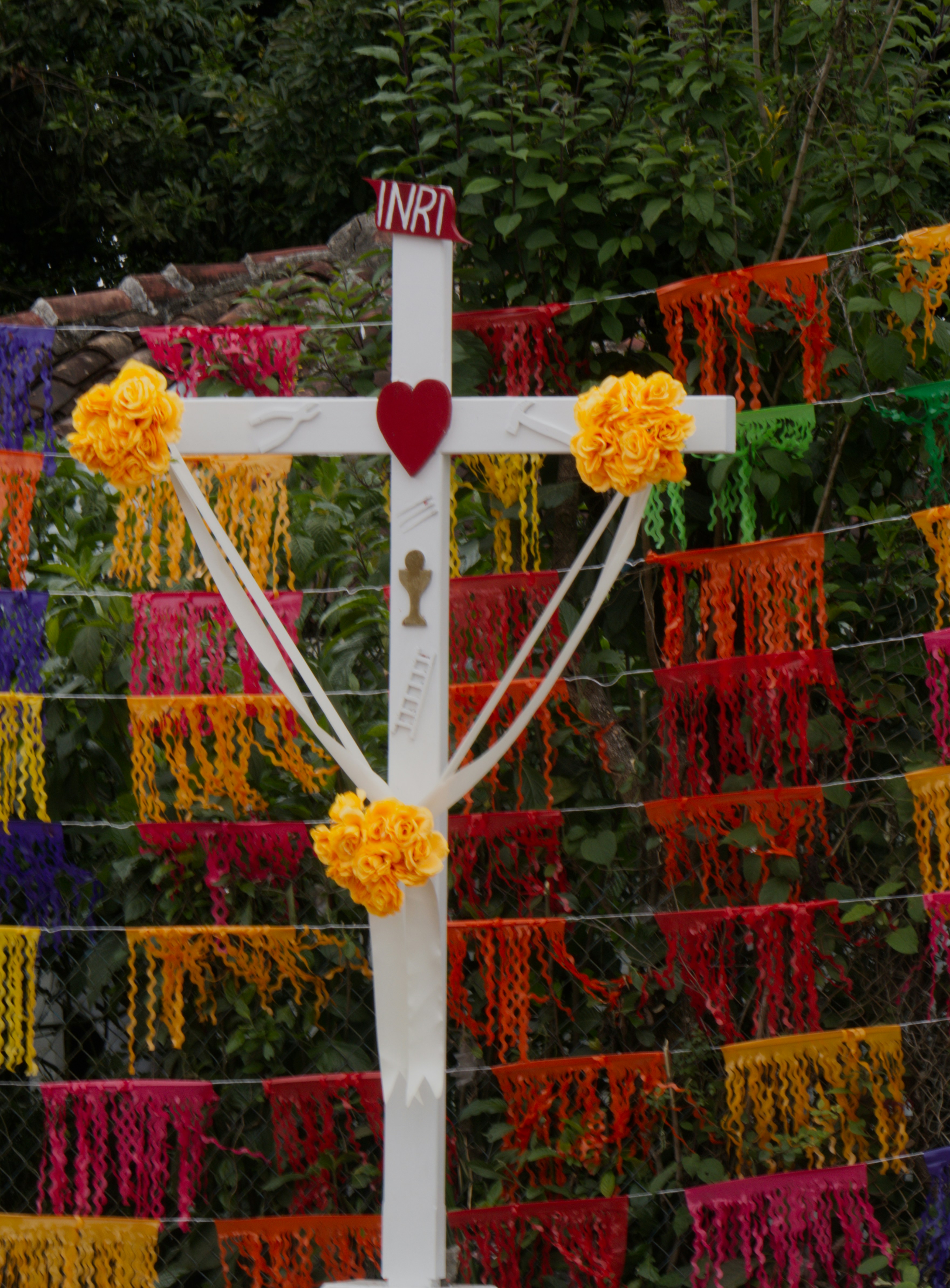 Cross of Color: A Festive Floral Shrine with Ribbons