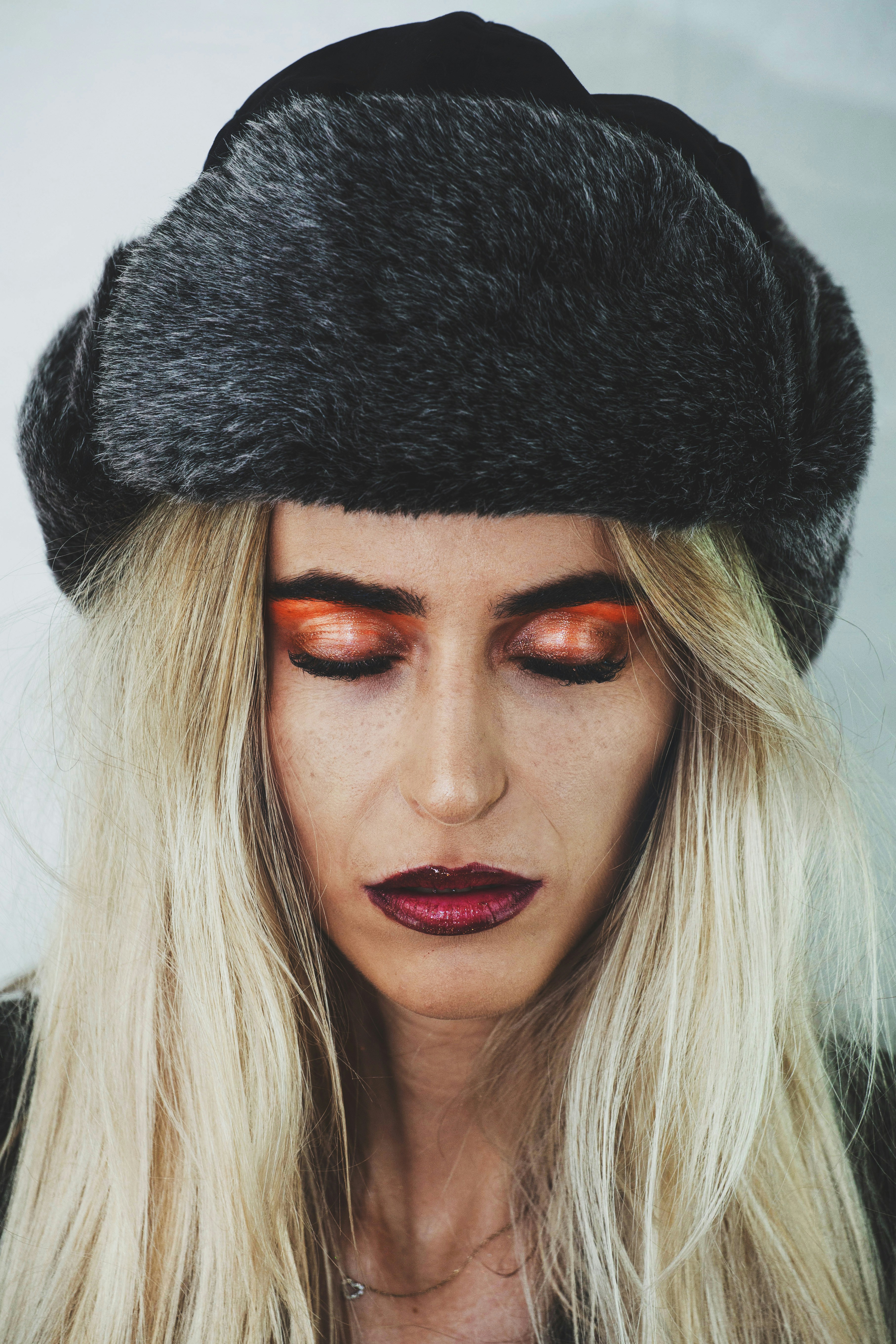Blonde Muse in a Midnight Fur: A Portrait in Quiet Intensity