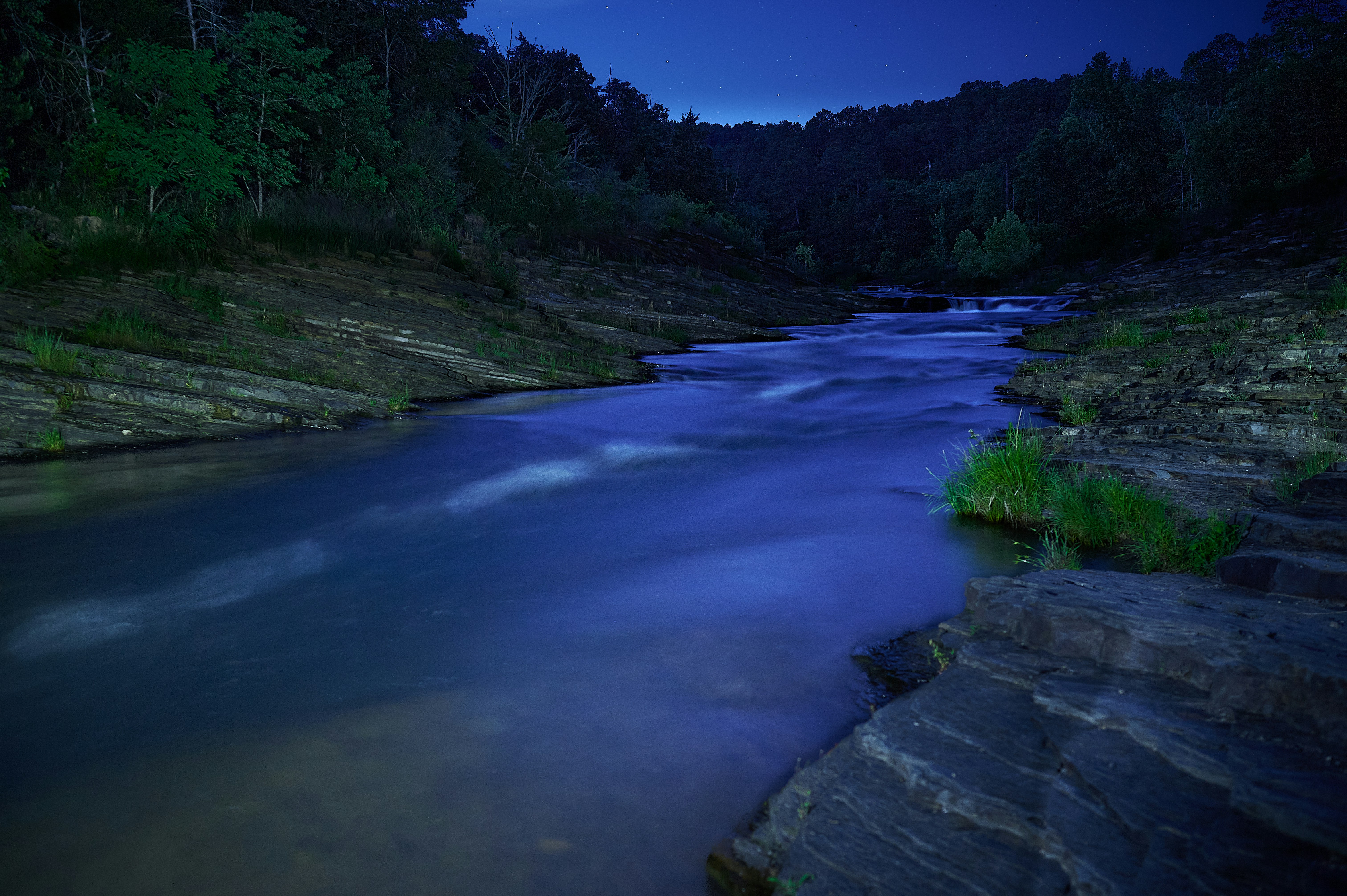 Moonlit River Whispers Along Tiered Rocks