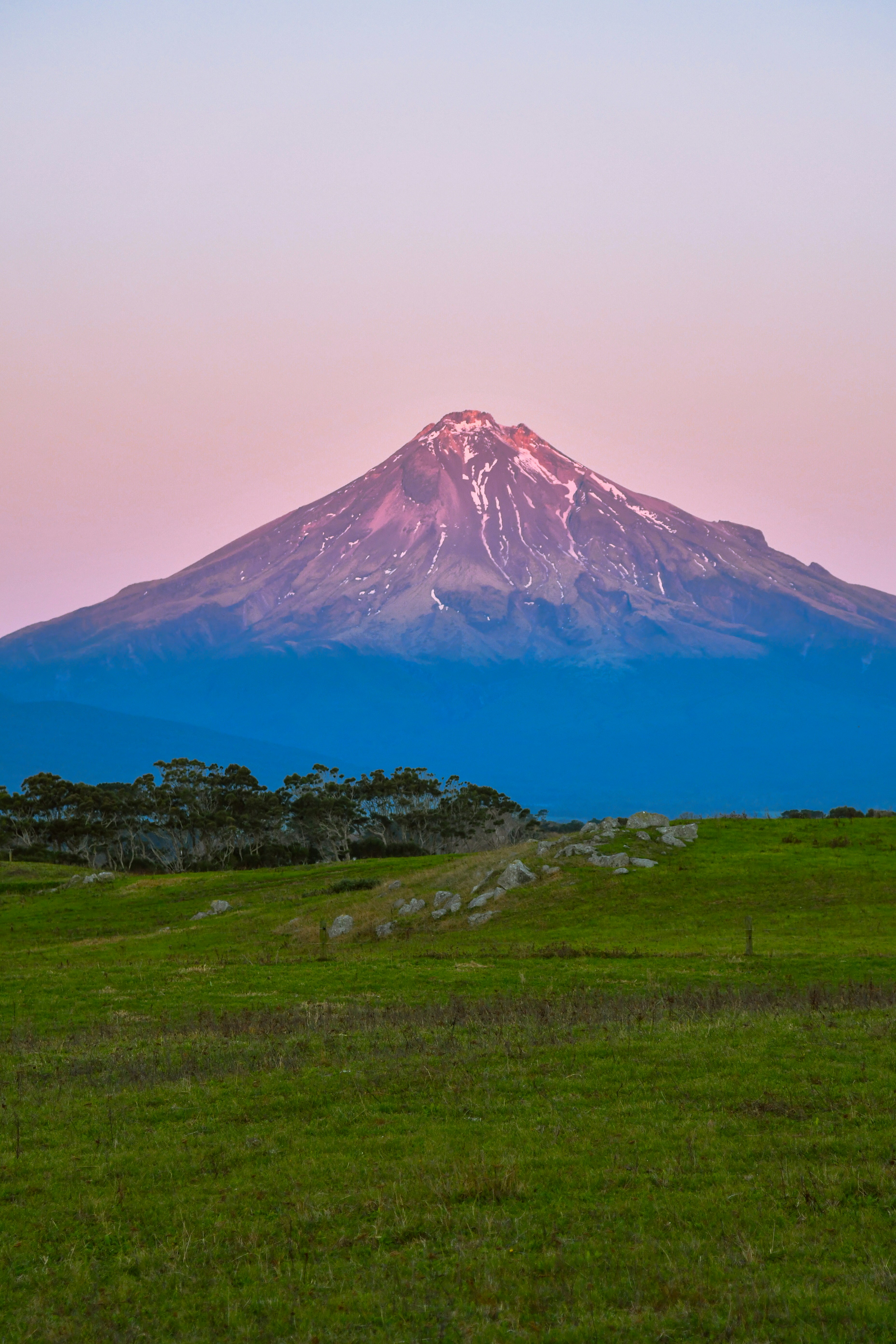 Pink Sky, Mountain Crown: A Quiet Summit in Dusk