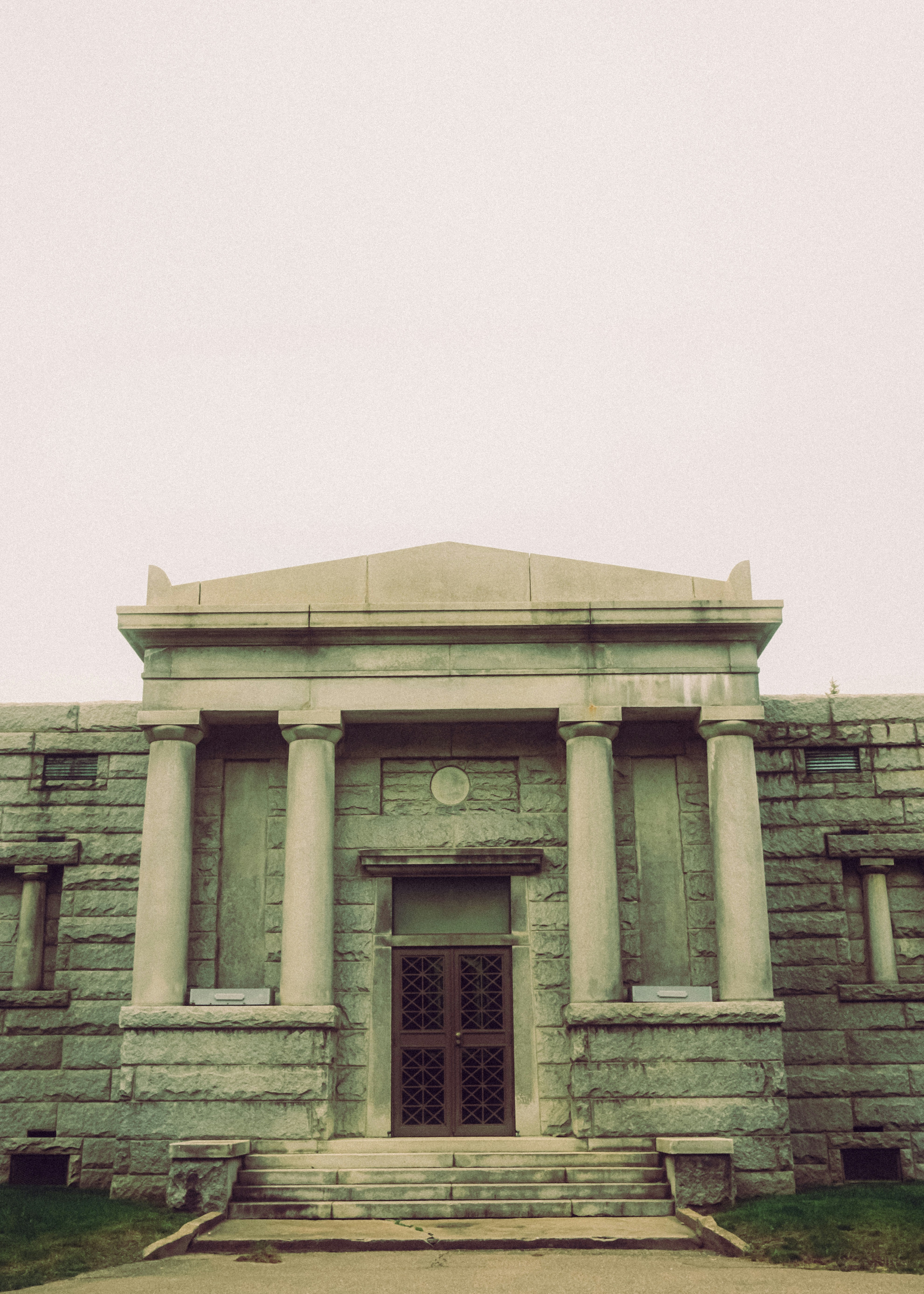 Templefront in Weathered Stone: A Quiet Monumental Facade