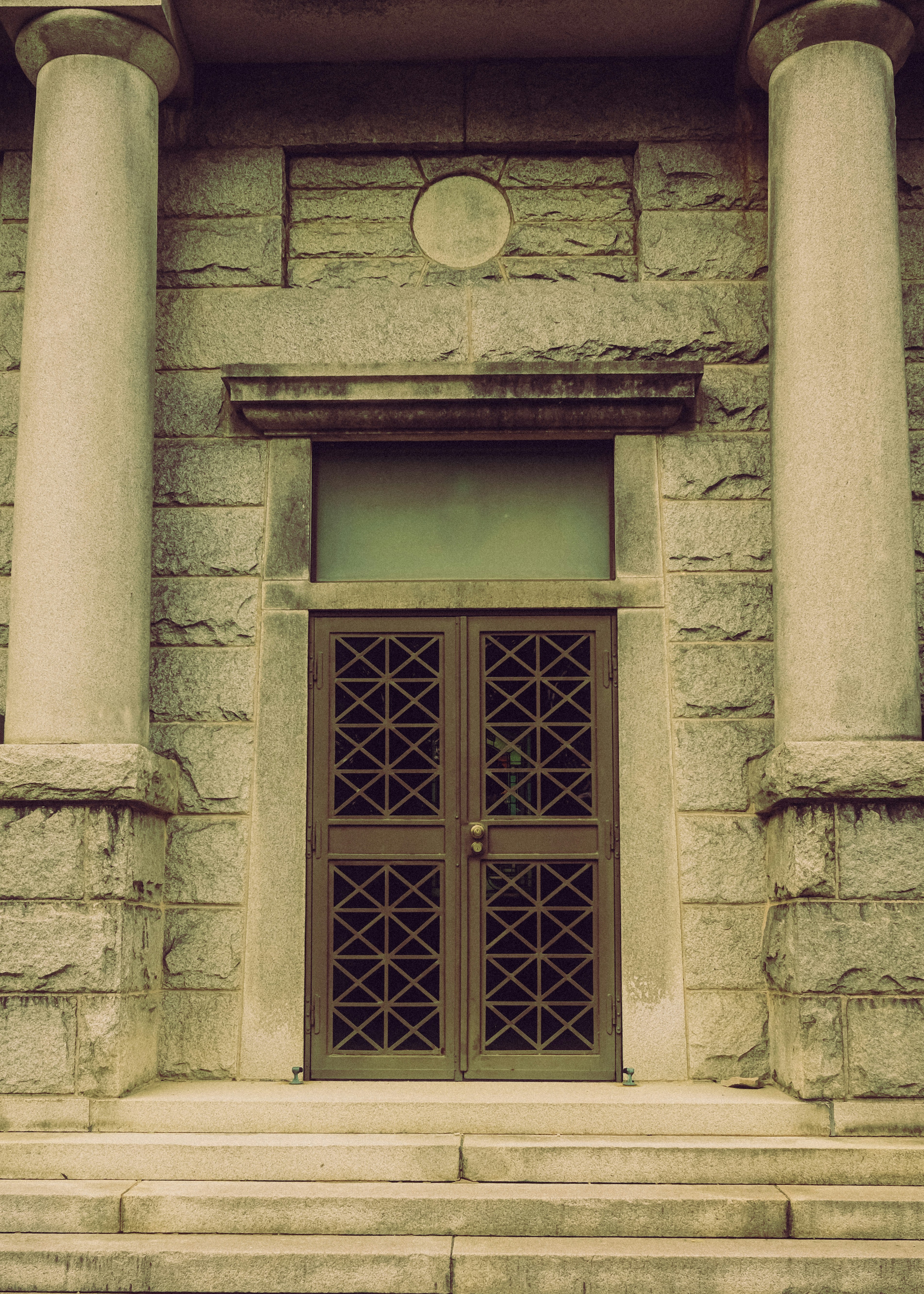 Stone Portal: A Quiet Gatekeeper Under Rigid Columns