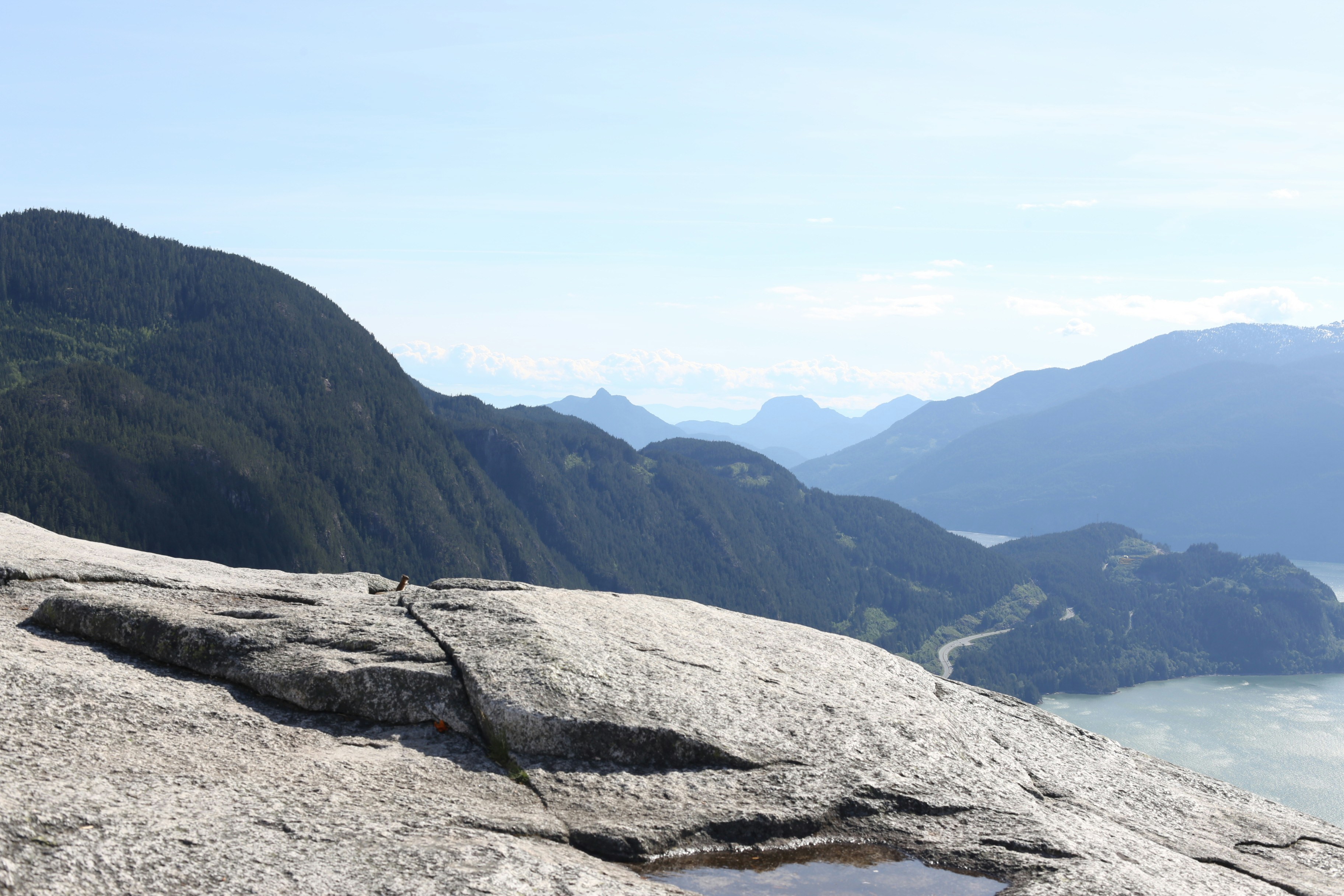 Granite Edge Over Alpine Fjord