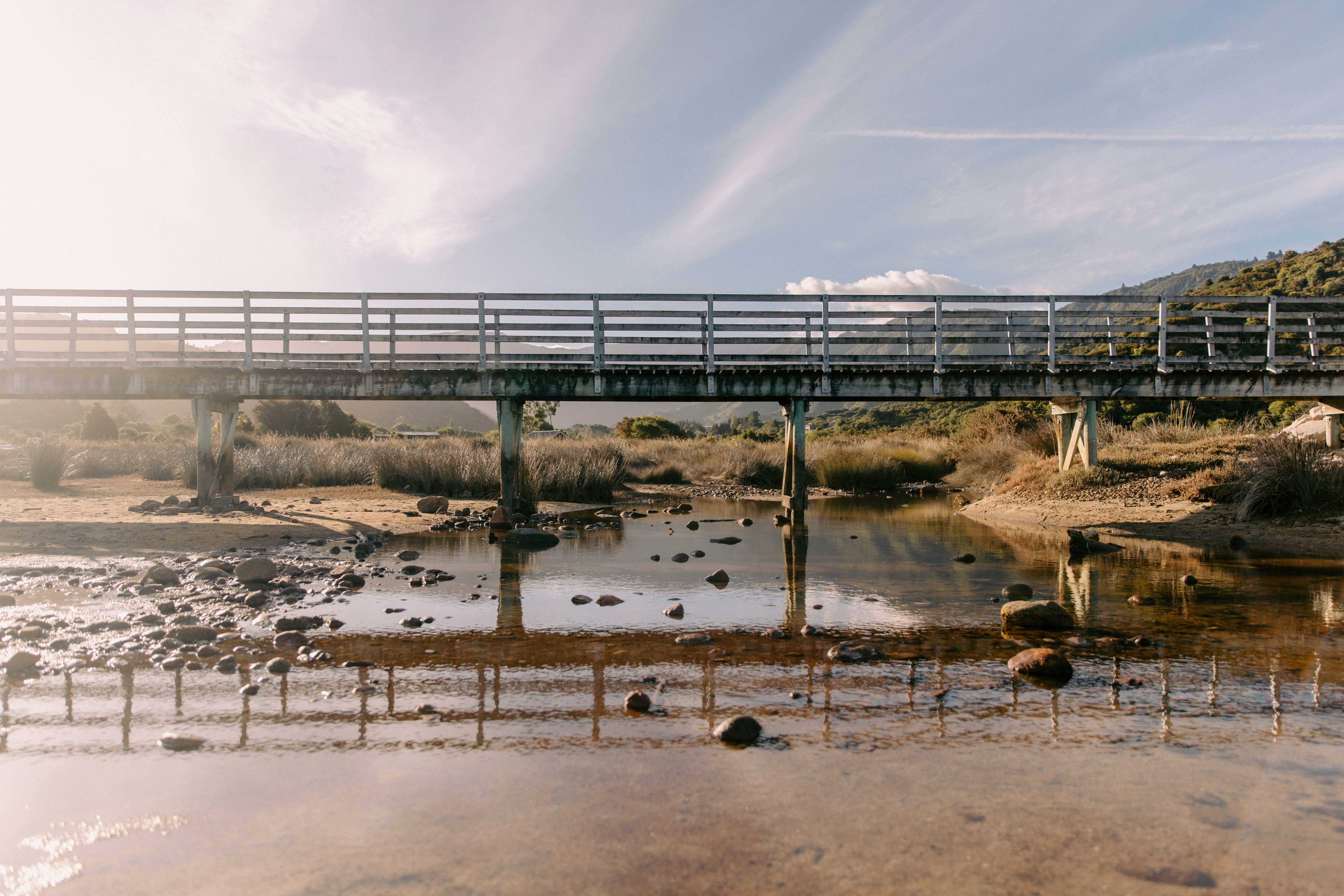 Bridge Over Quiet Tidal Flats at Golden Hour