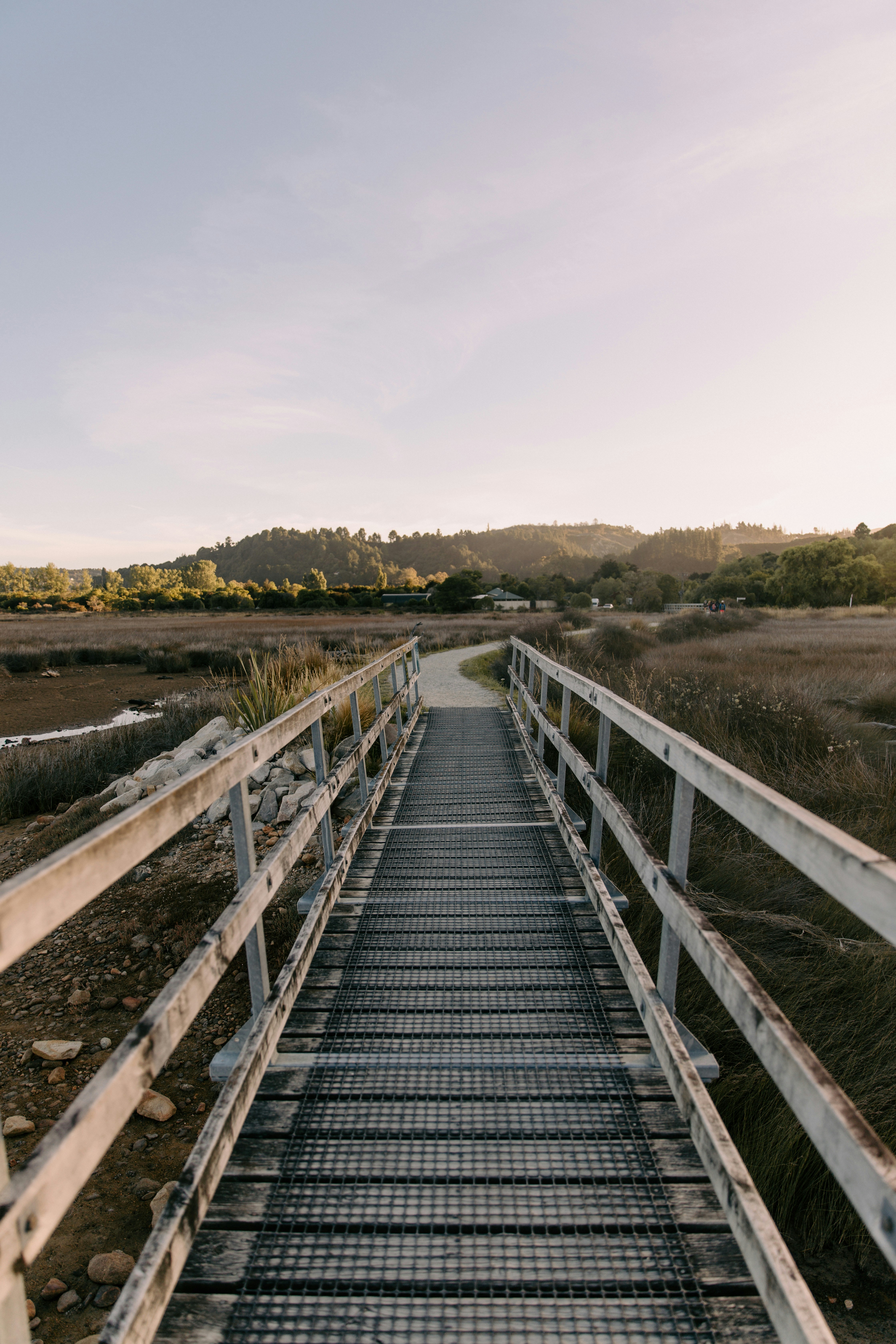 Wooden Footbridge Stretching Toward a Quiet Horizon
