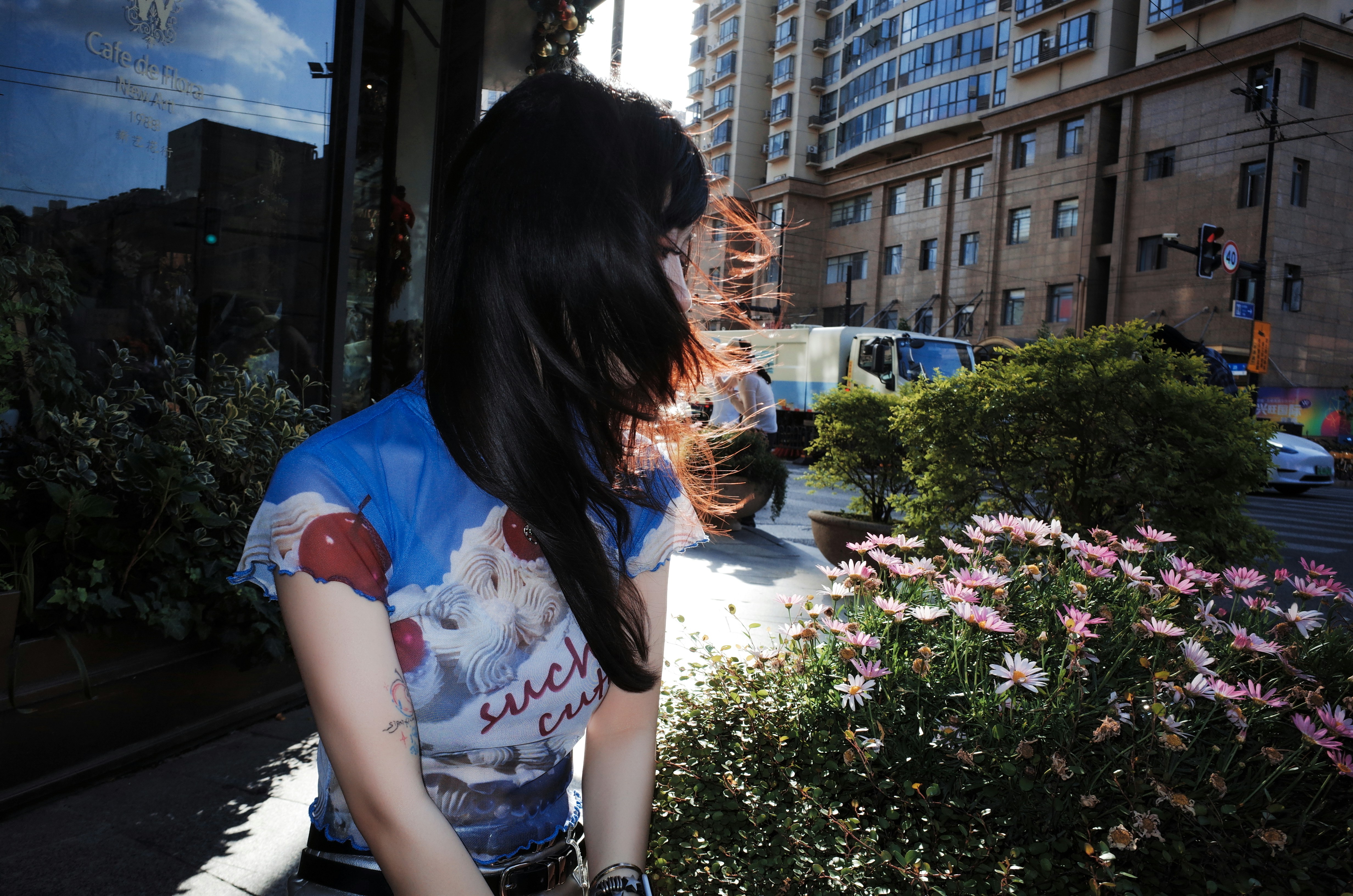 Sunlit Portrait by the Flower Bed