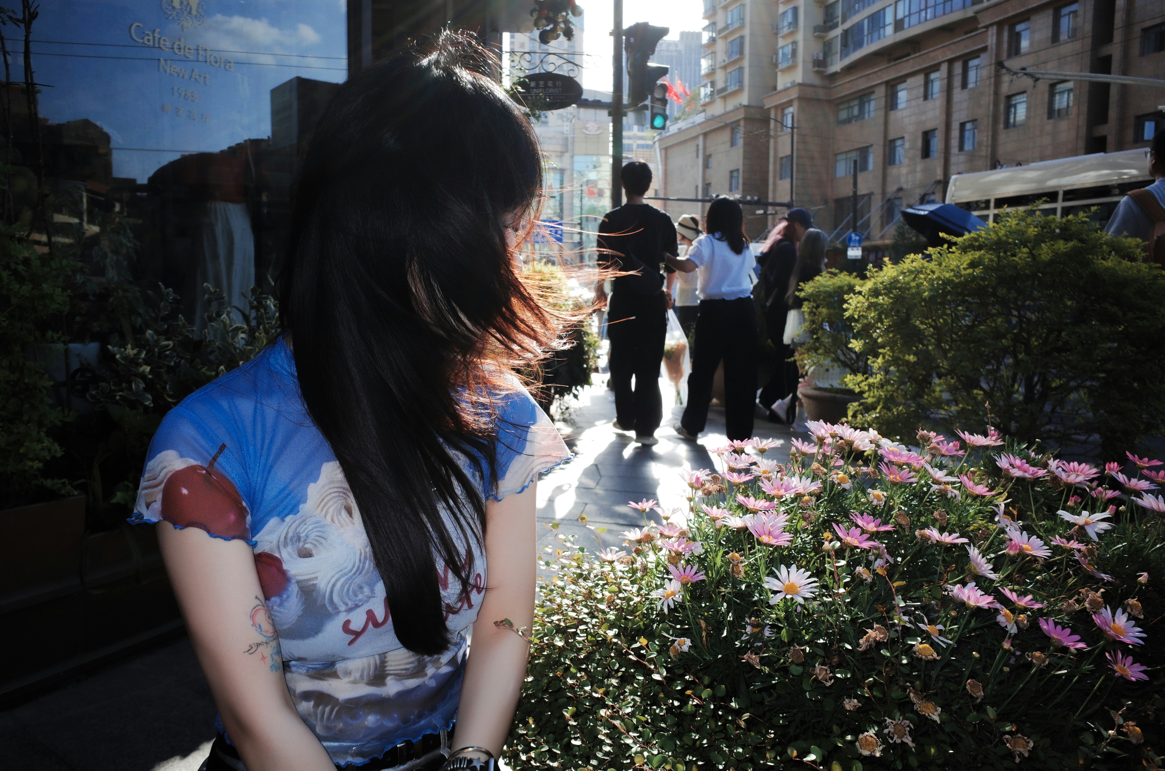 Sunlit City Portrait Amid Blooming Border