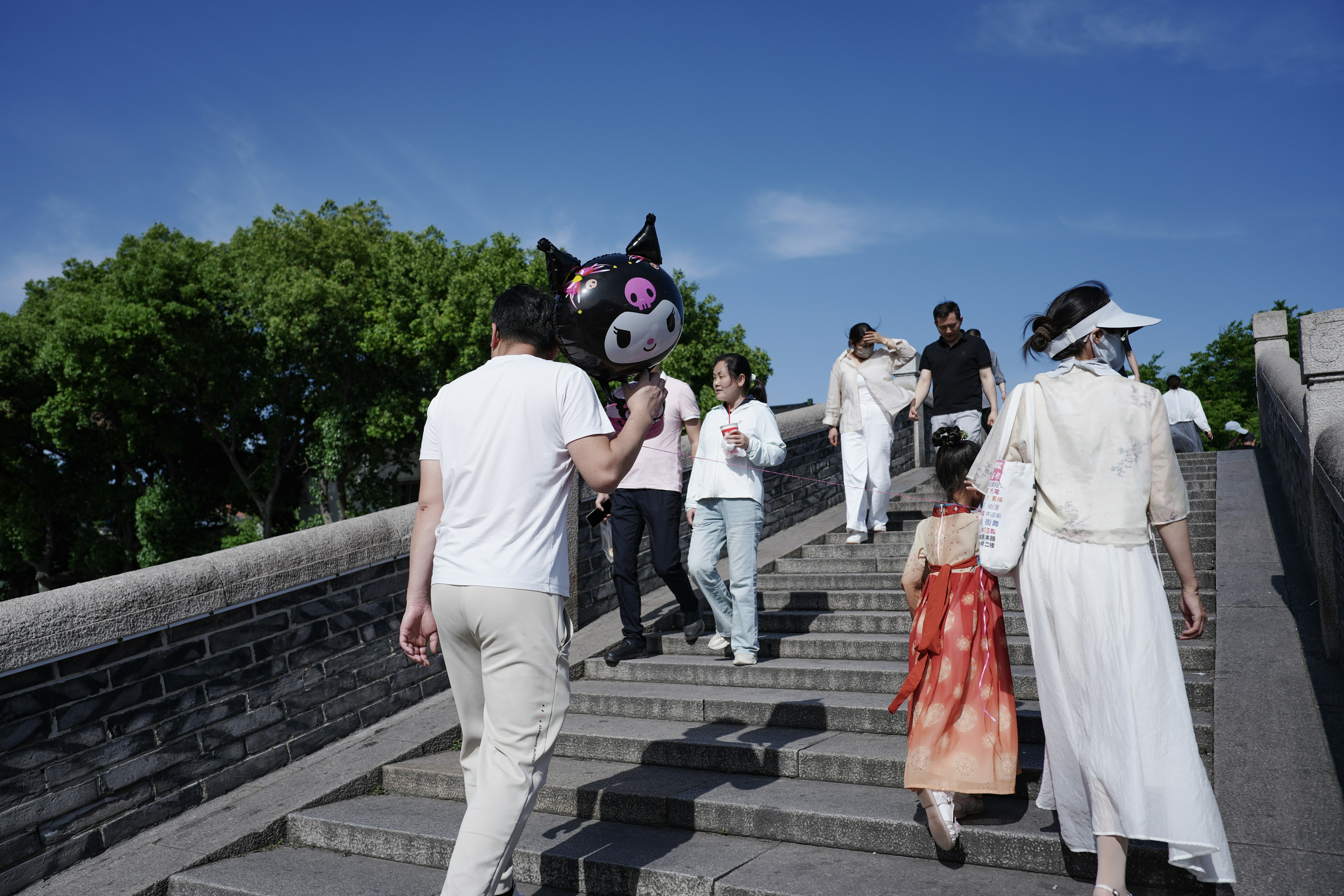 Staircase Gathering with a Balloon Mascot
