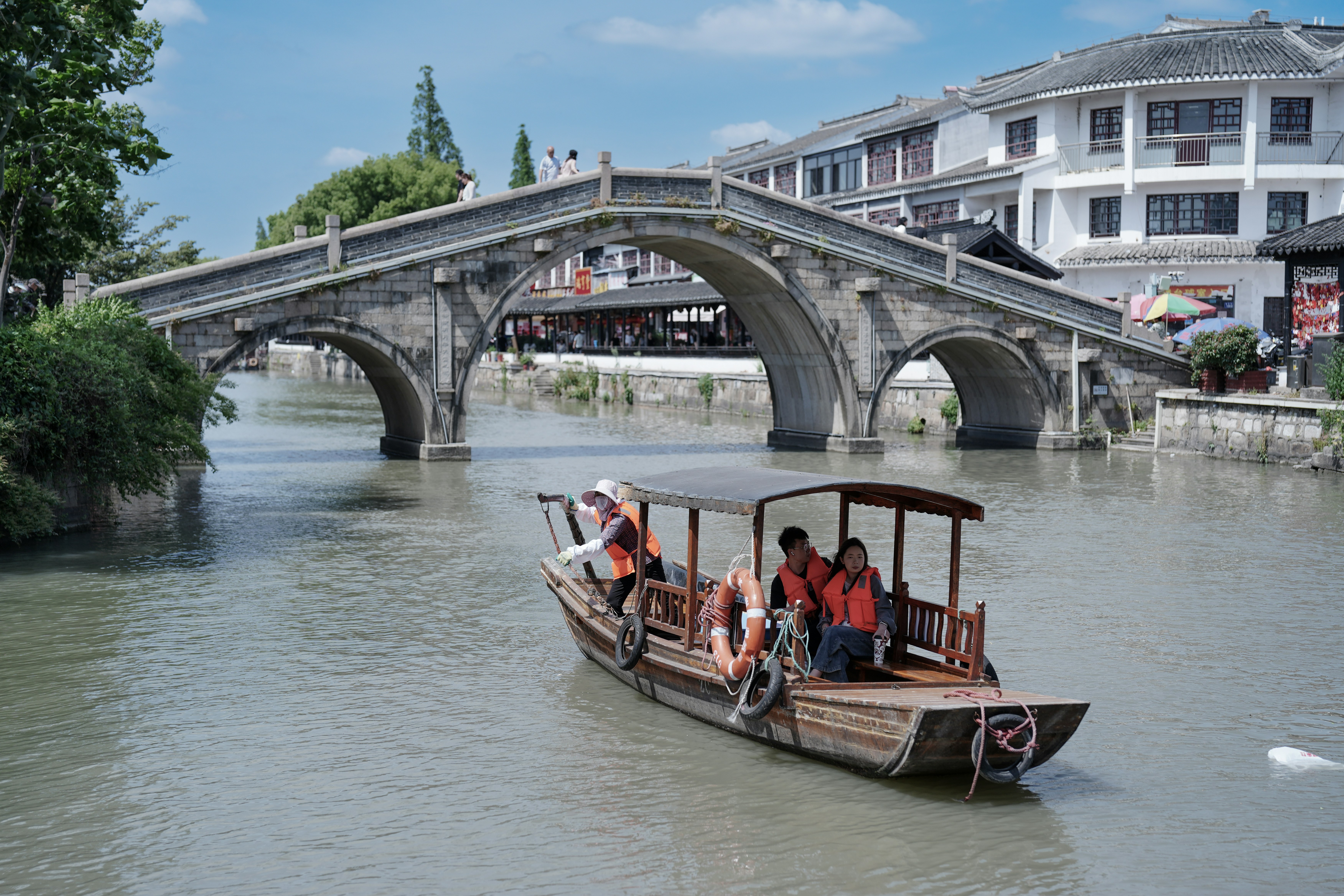 Boat Parade Under the Stone Arch: A Quiet Riverside Crossing