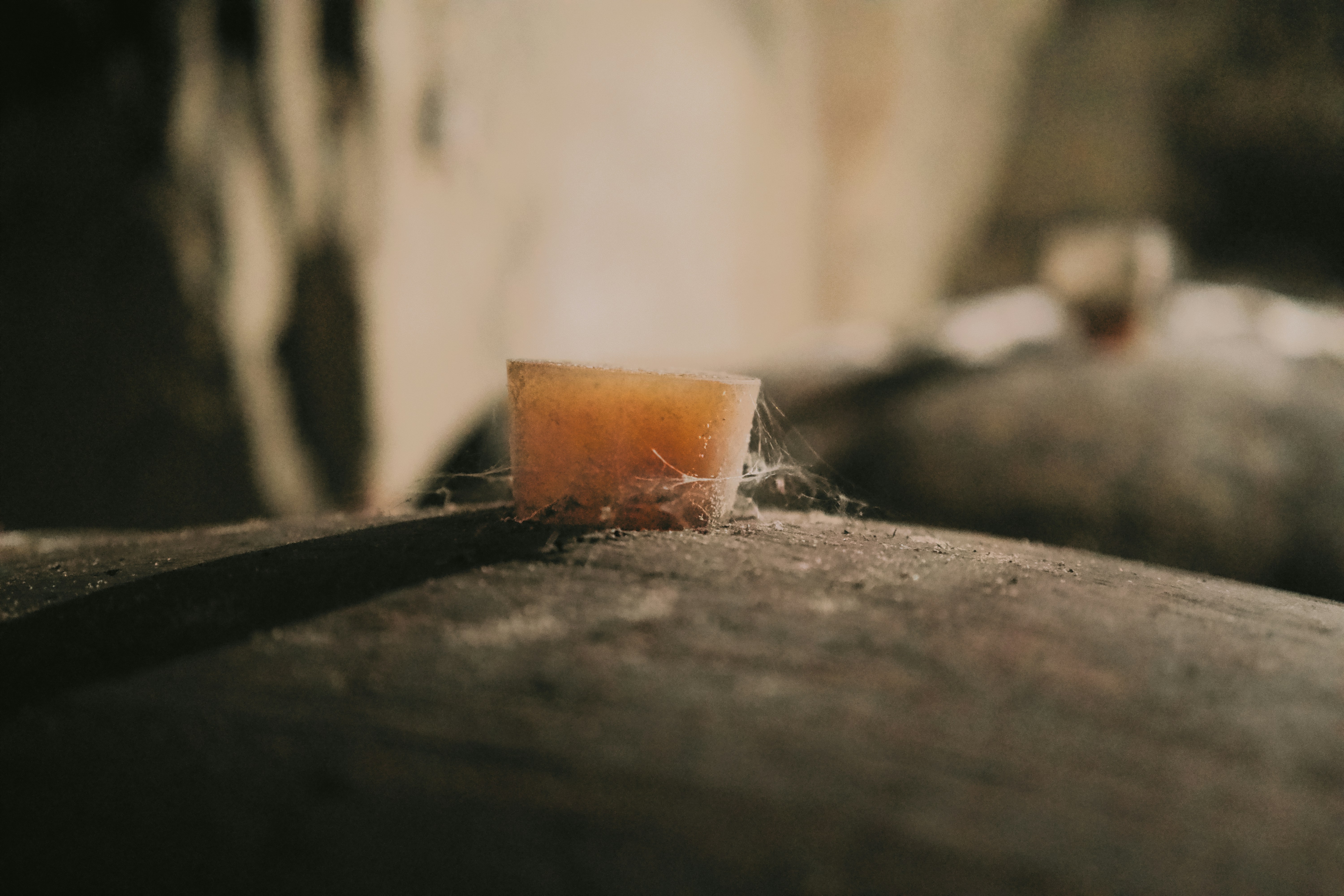 Tiny Amber on a Weathered Surface: A Macro Moment
