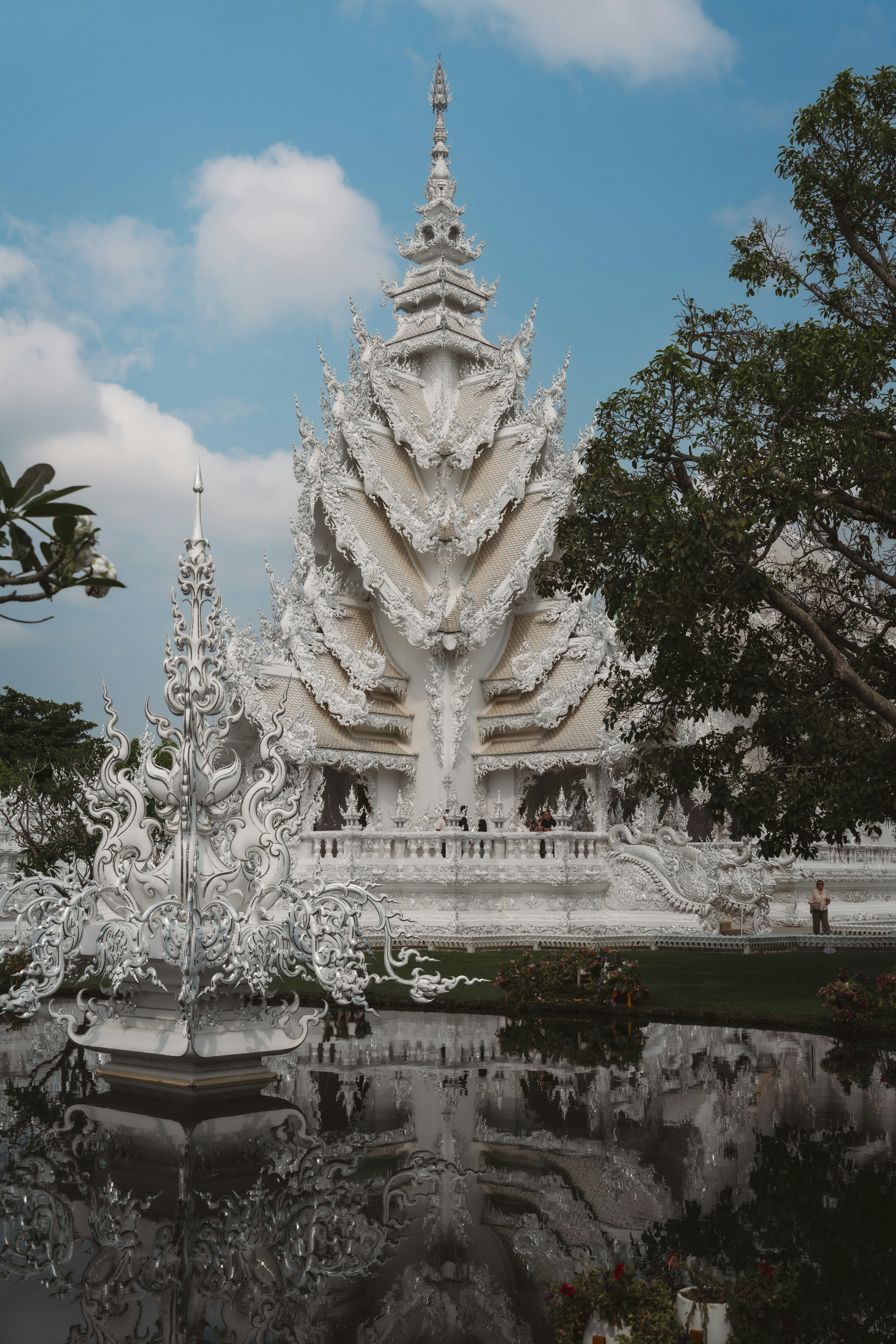 Ivory Spires: A White Temple in Quiet Reflection