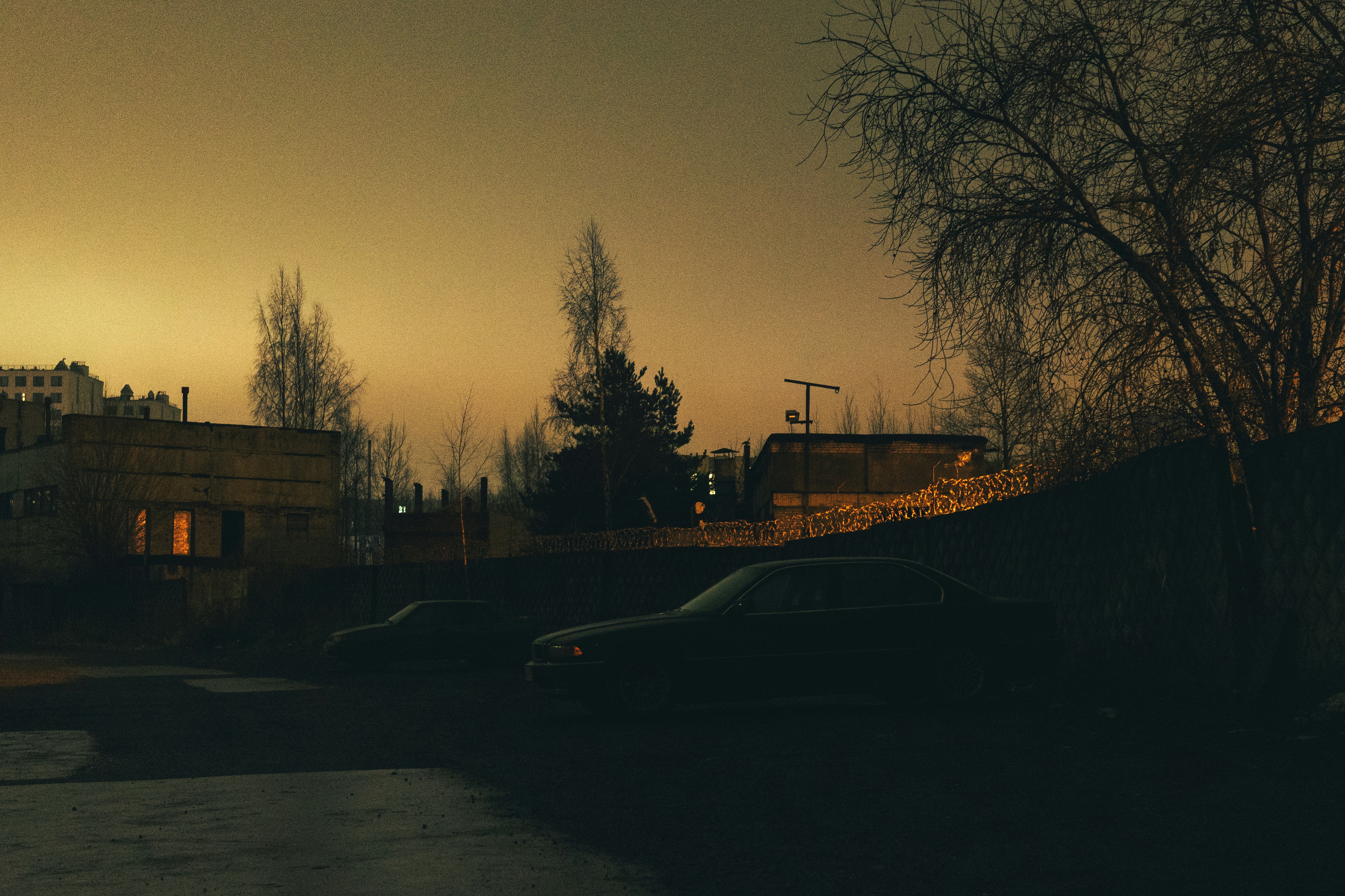 Dusk in the Parking Lot: Quiet Geometry Under Streetlights
