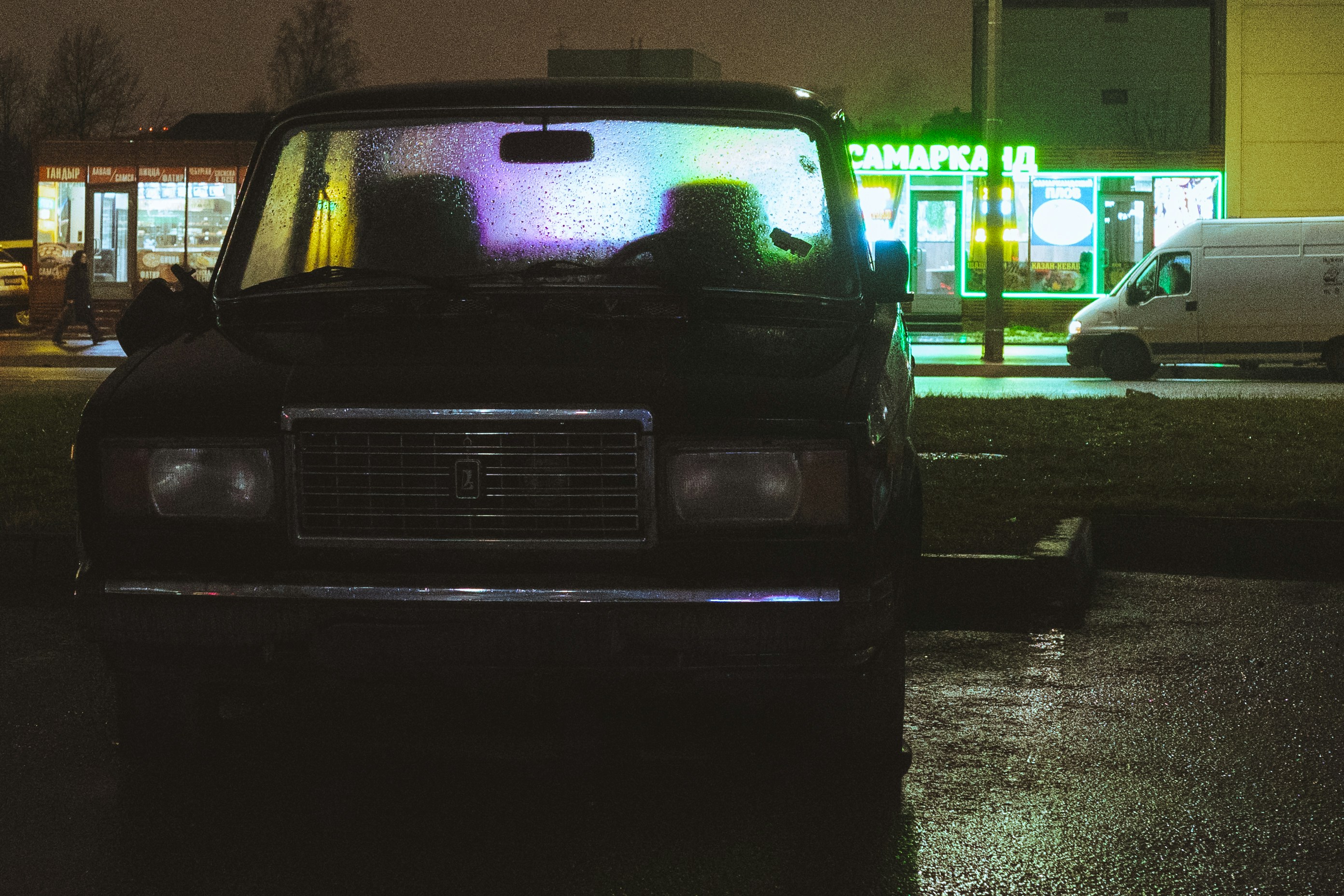 Dark Street Sentinel: A Nighttime Pickup in Neon Glow