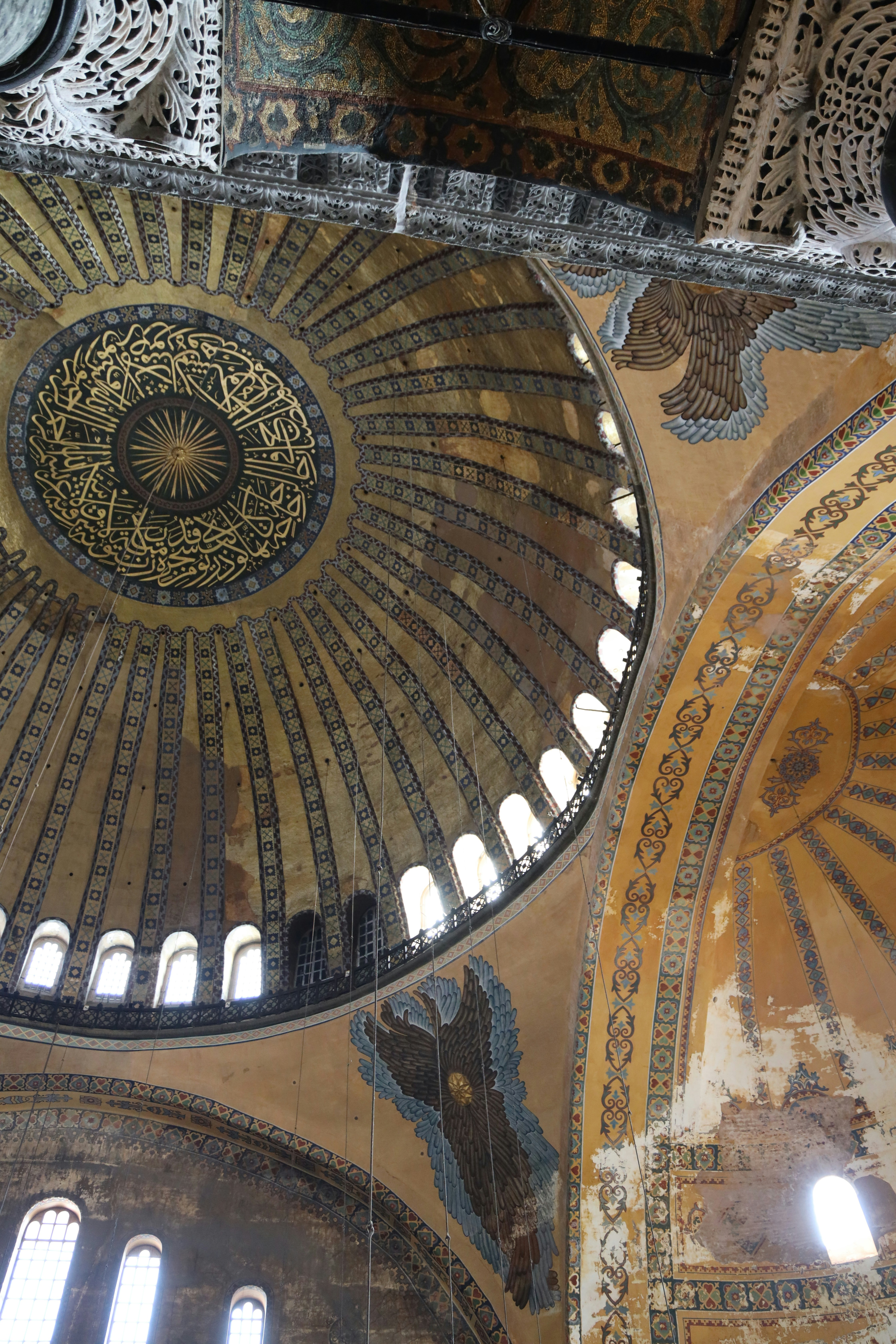 Majestic Dome Haunting the Light: An Interior of Golden Arches and Mosaic