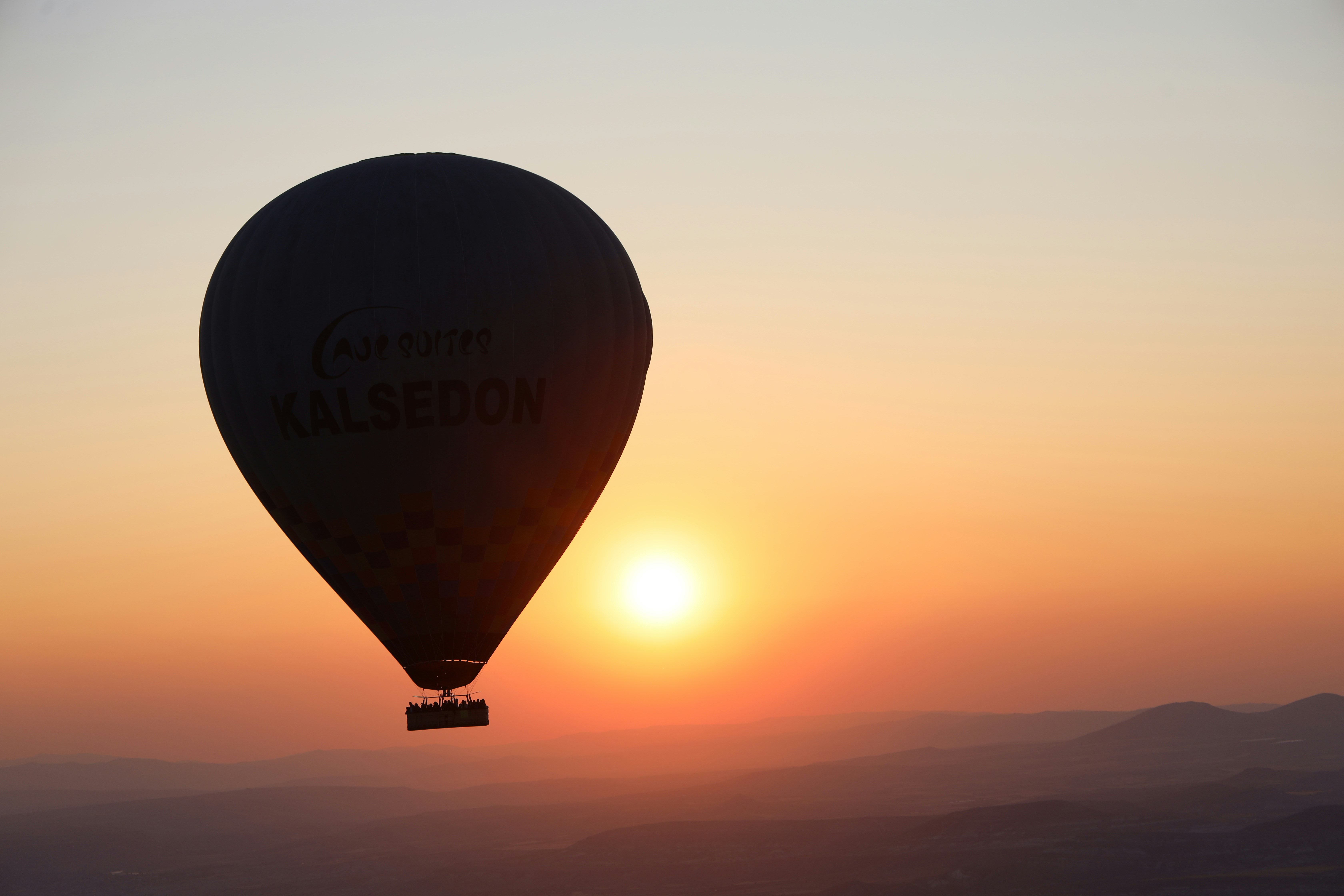 Sunlit Balloon Drift at Dusk