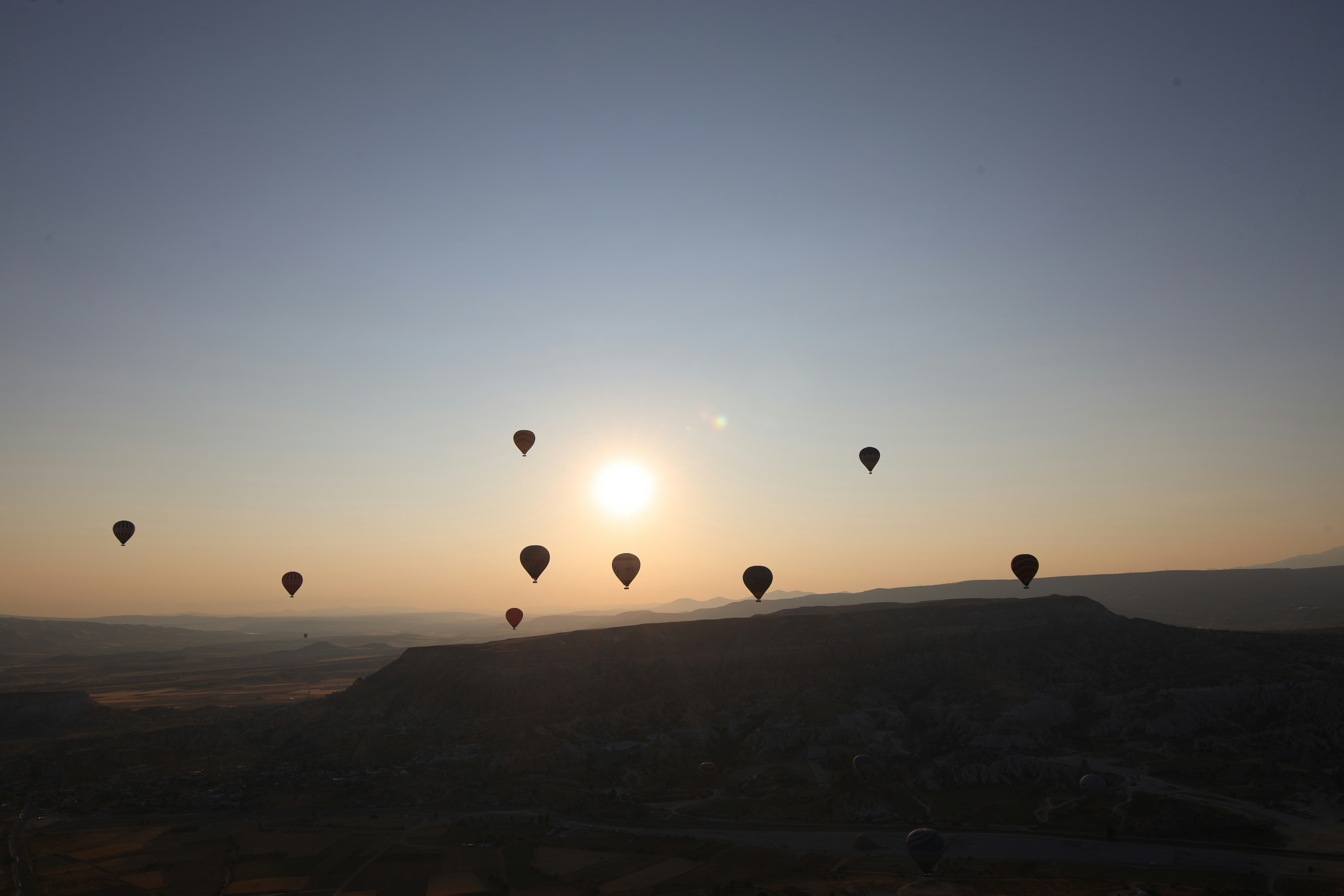 Sunrise Over the Silent Basalt Ridge with Balloons