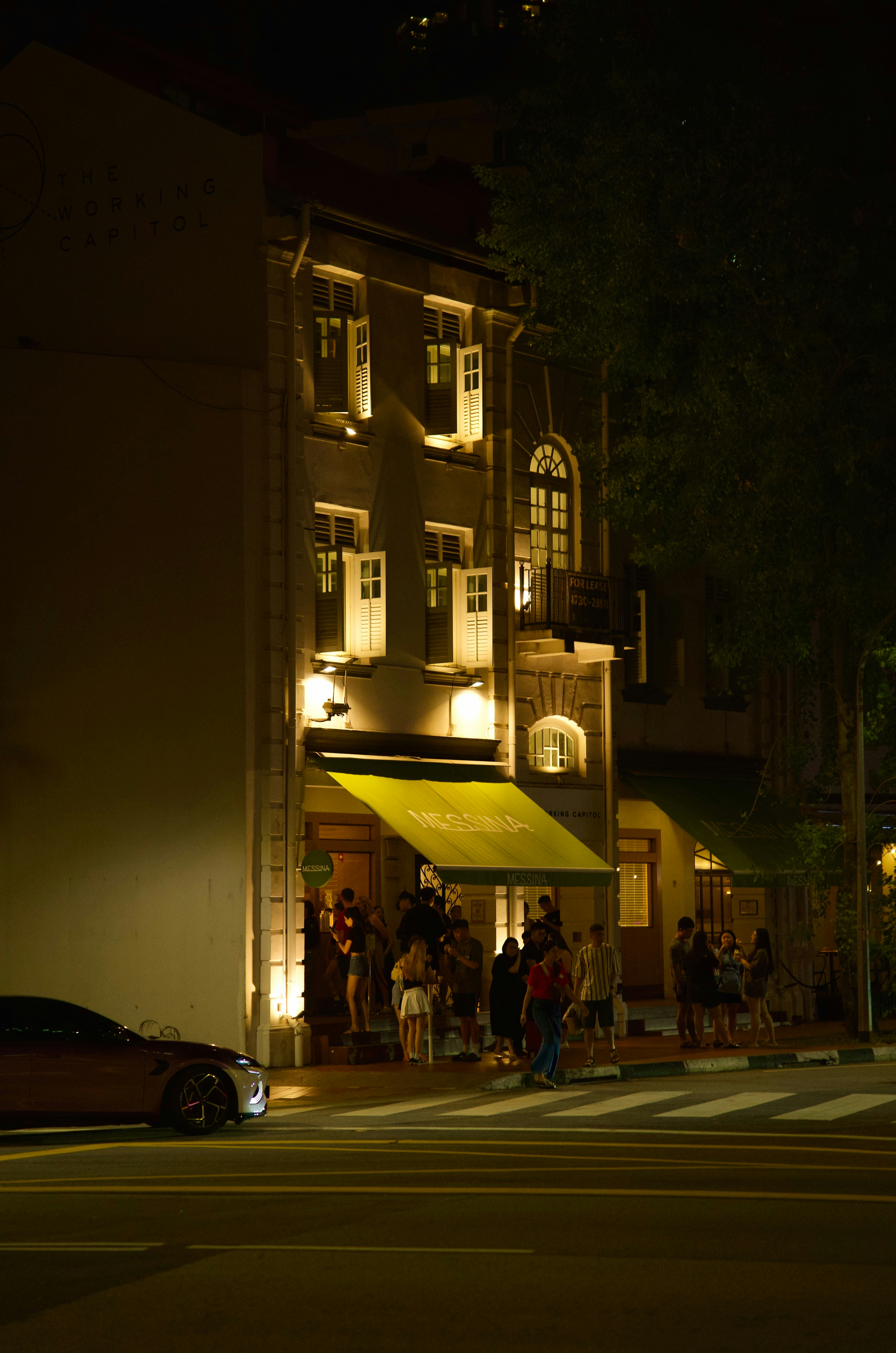 Nightlife in a Sonned Street: A Corner Café Awakens