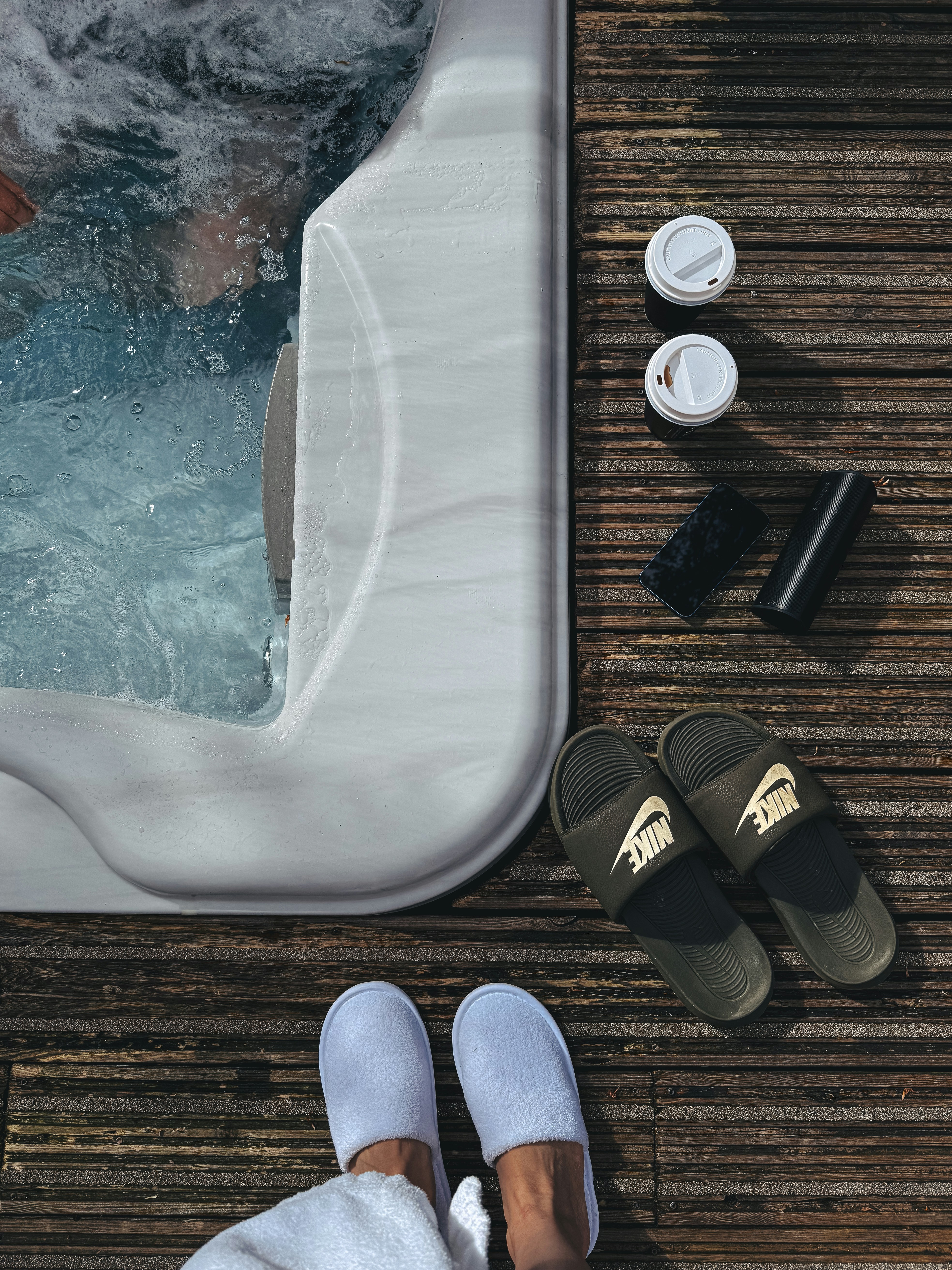 Footwear at the Edge: A Quiet Moment by the Poolside Deck