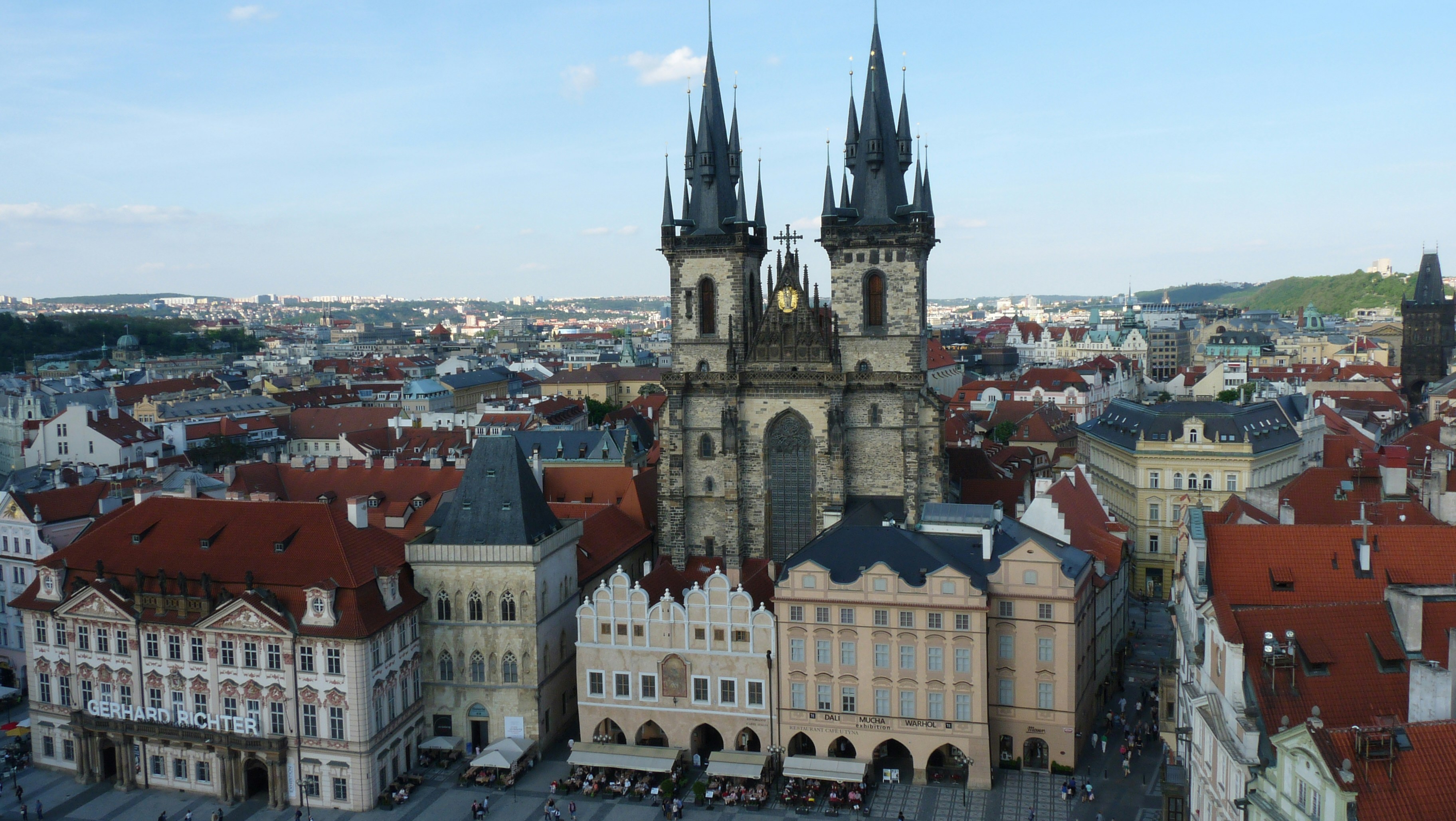 Gothic Clock Tower Domes Over Prague’s Red Roofscape