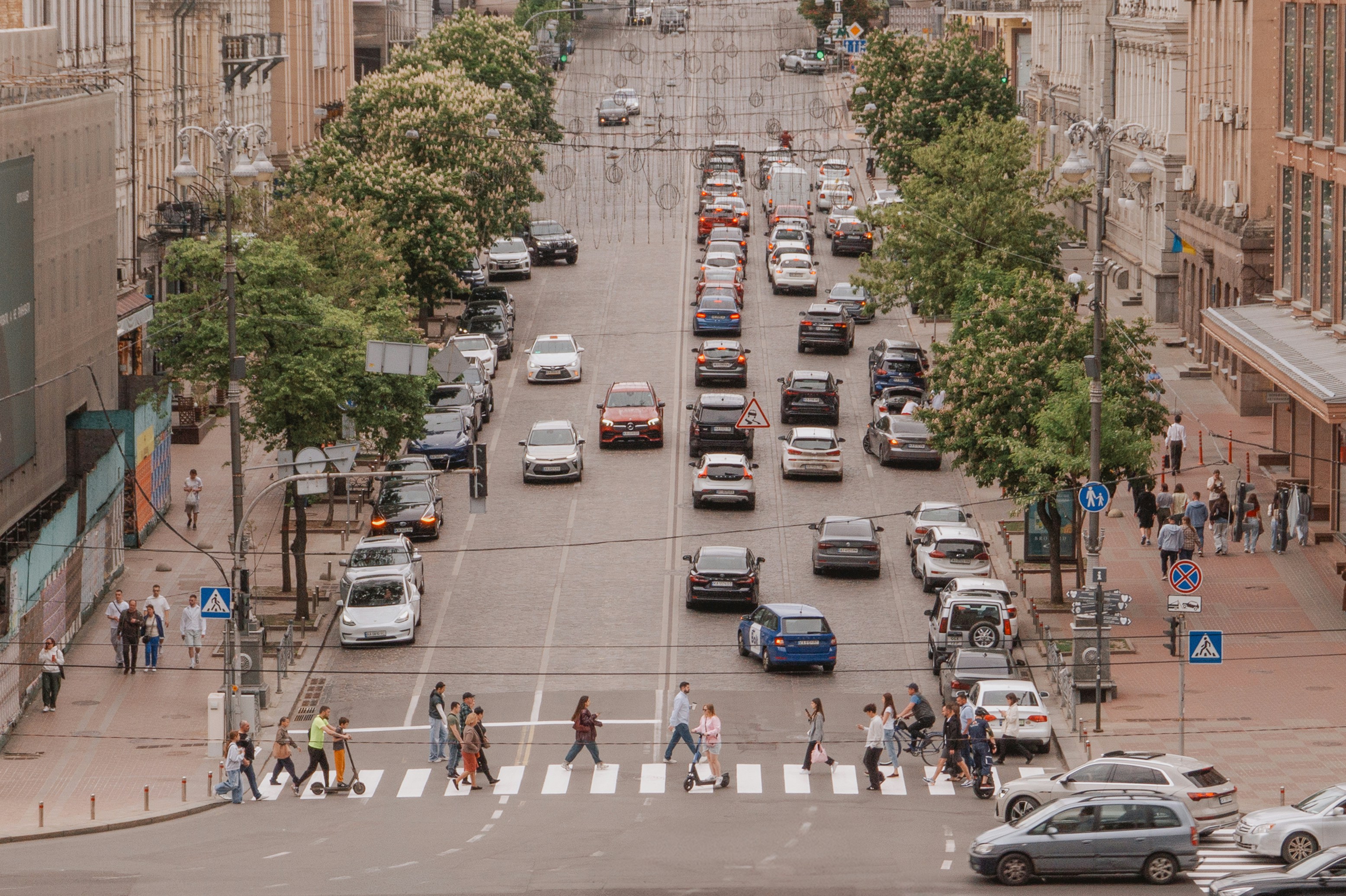 Crosswalk Symphony: Pedestrians, Cars, and Quiet City Pace